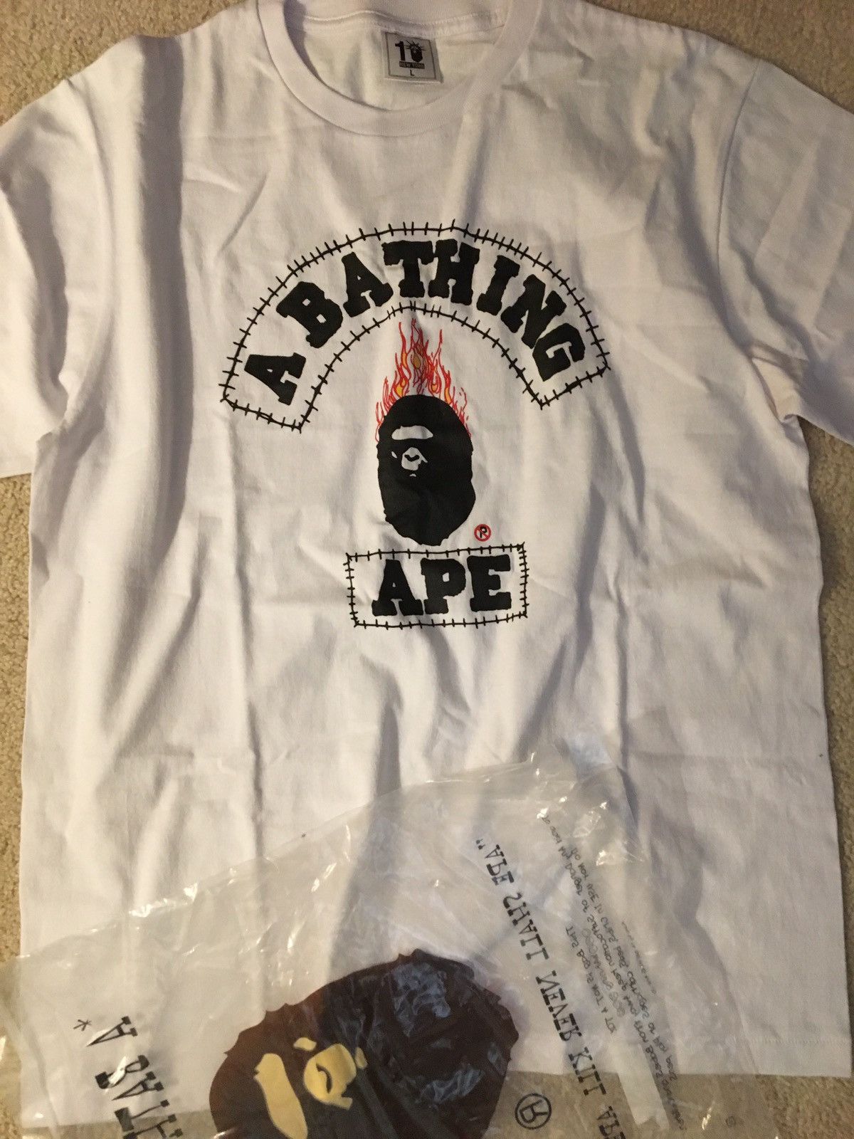 Bape × Travis Scott Travis Scott x Bape 10th anniversary La Flame Shirt ...