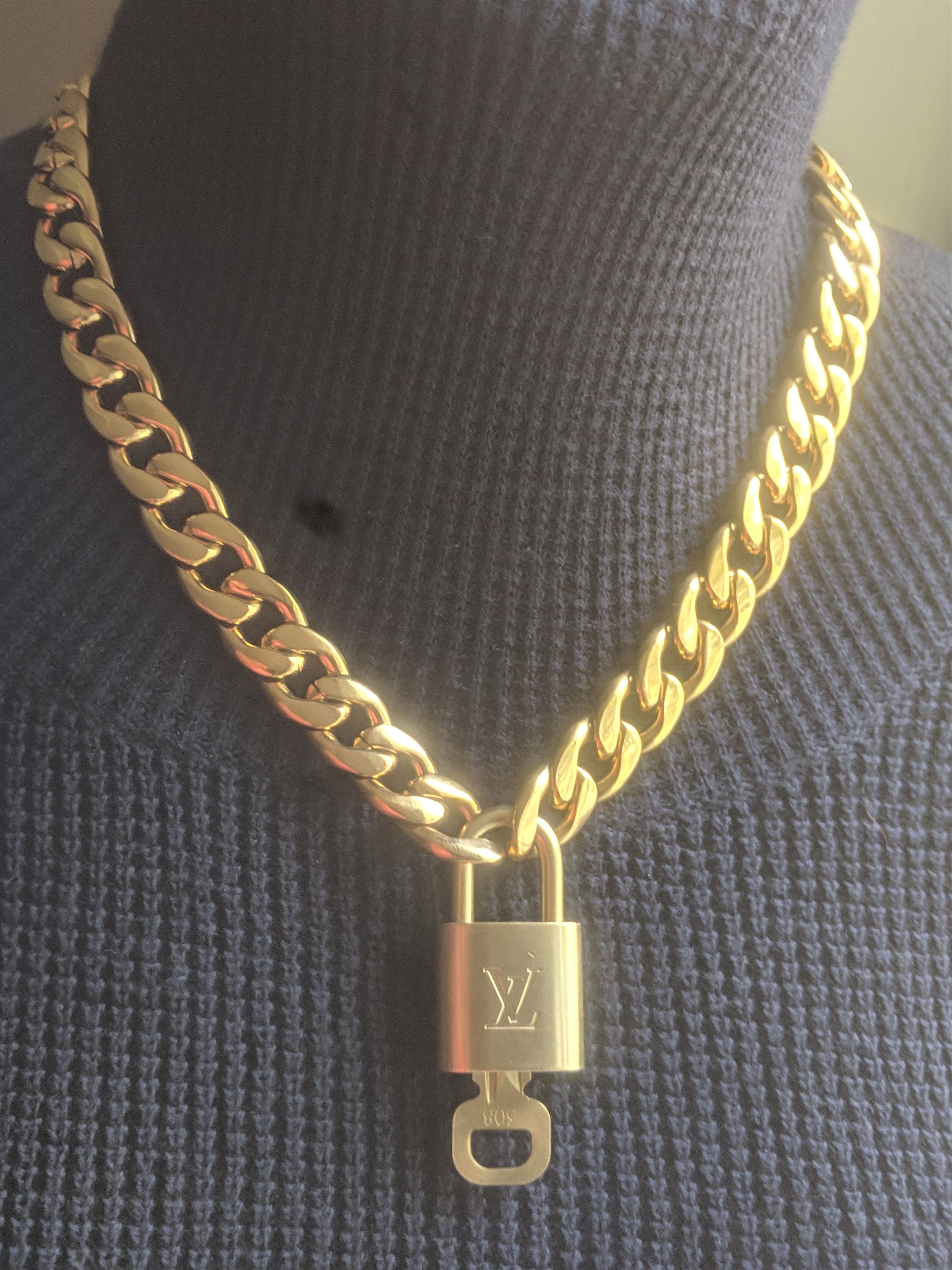 Louis Vuitton Authentic Louis Vuitton Padlock Lock and Key Put on a ...