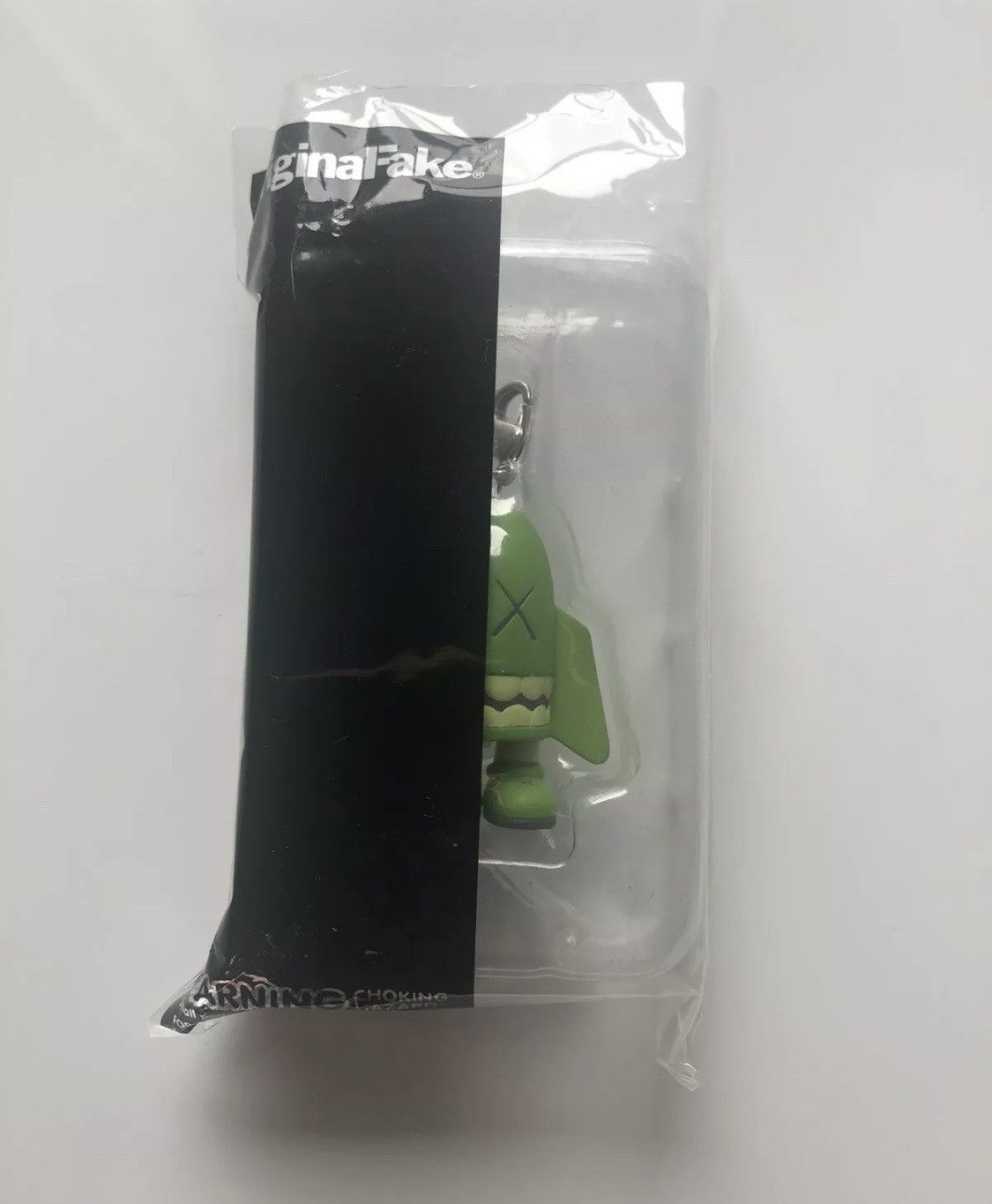 Original Fake Kaws original fake blitz keychain green | Grailed