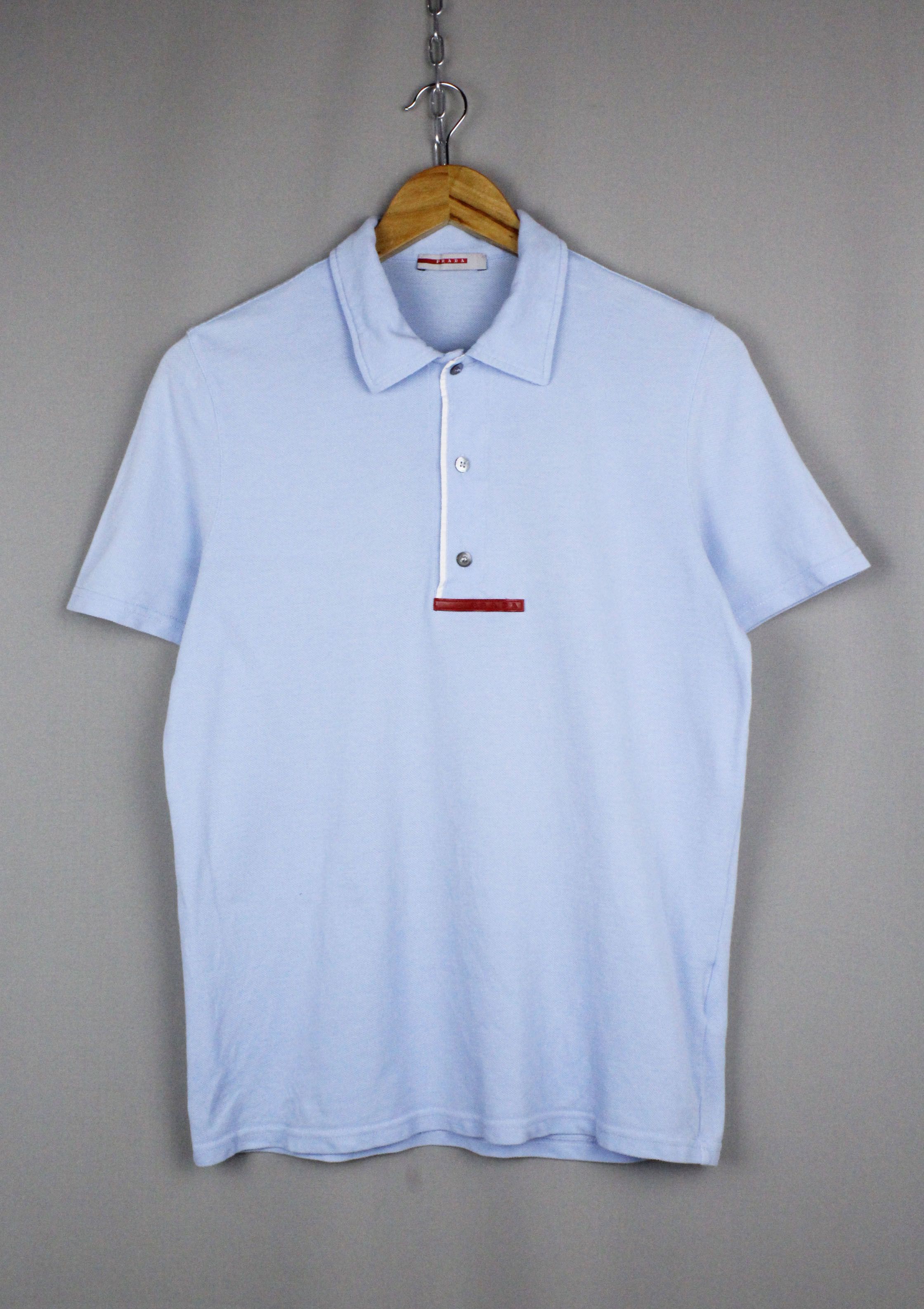 Prada Prada Red Logo Tab Light Blue Polo Shirt | Grailed