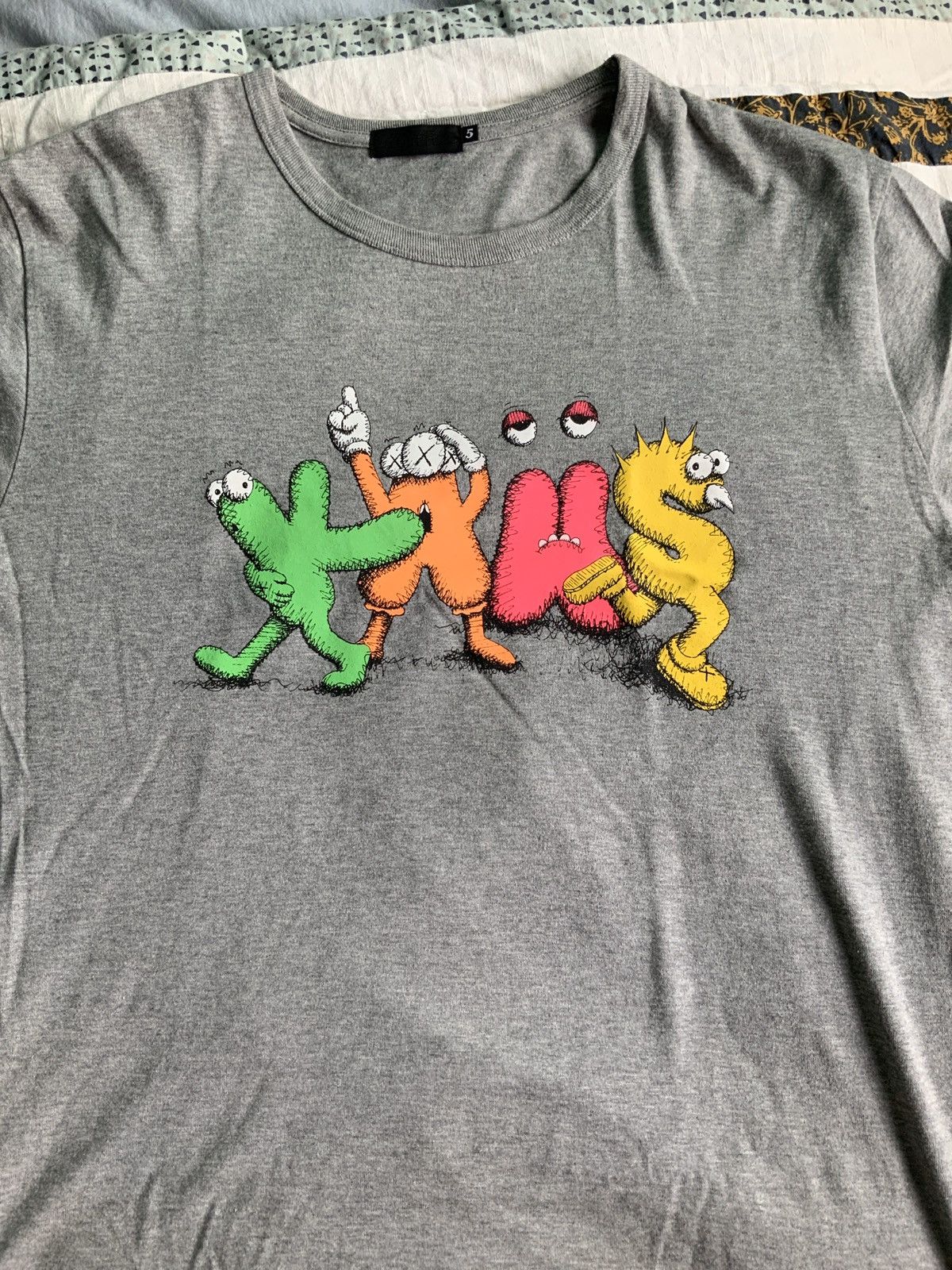 Kaws × Original Fake Original fake logo shirt size 5 | Grailed
