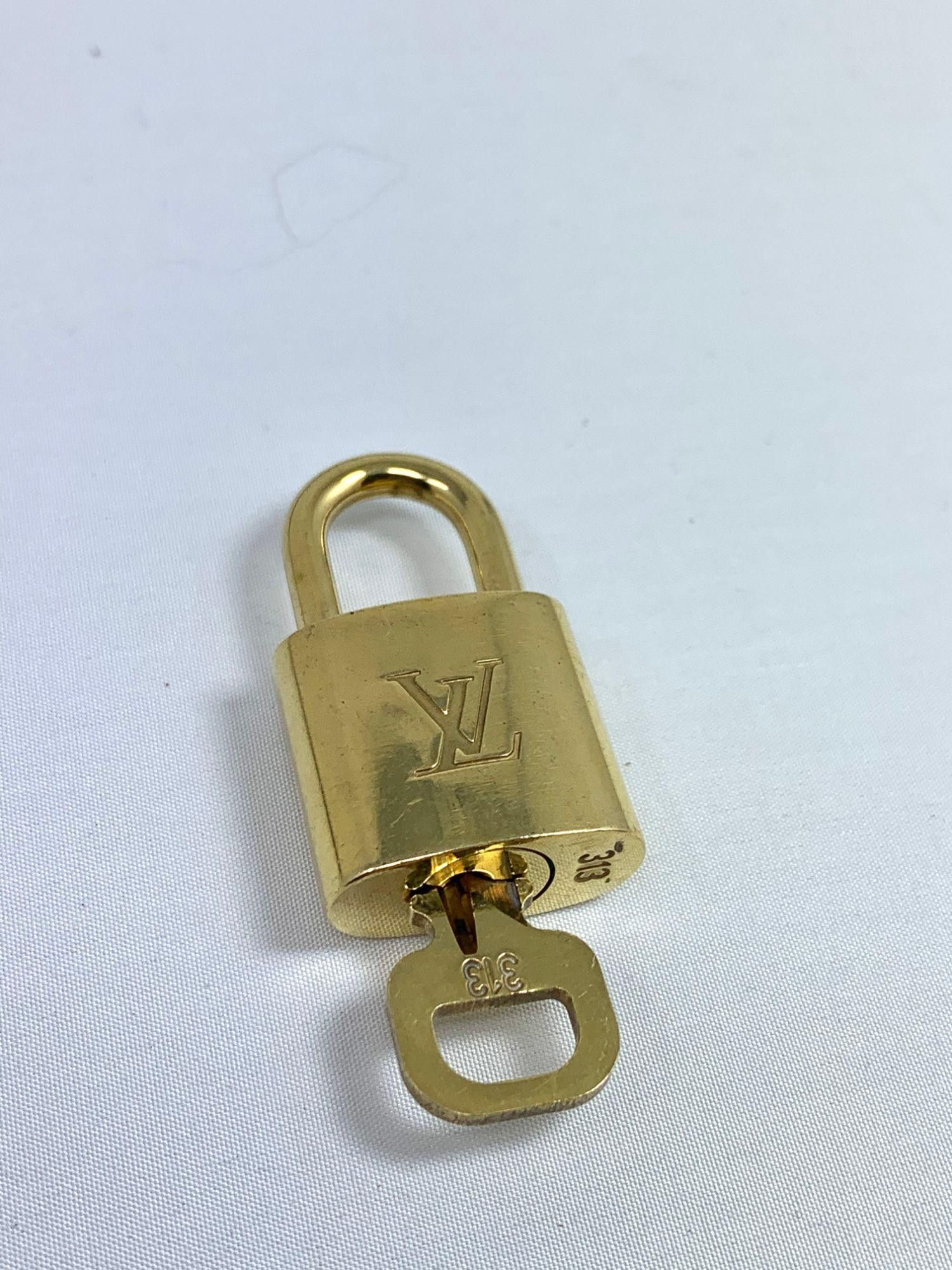 Louis Vuitton Louis Vuitton Gold Lock | Grailed