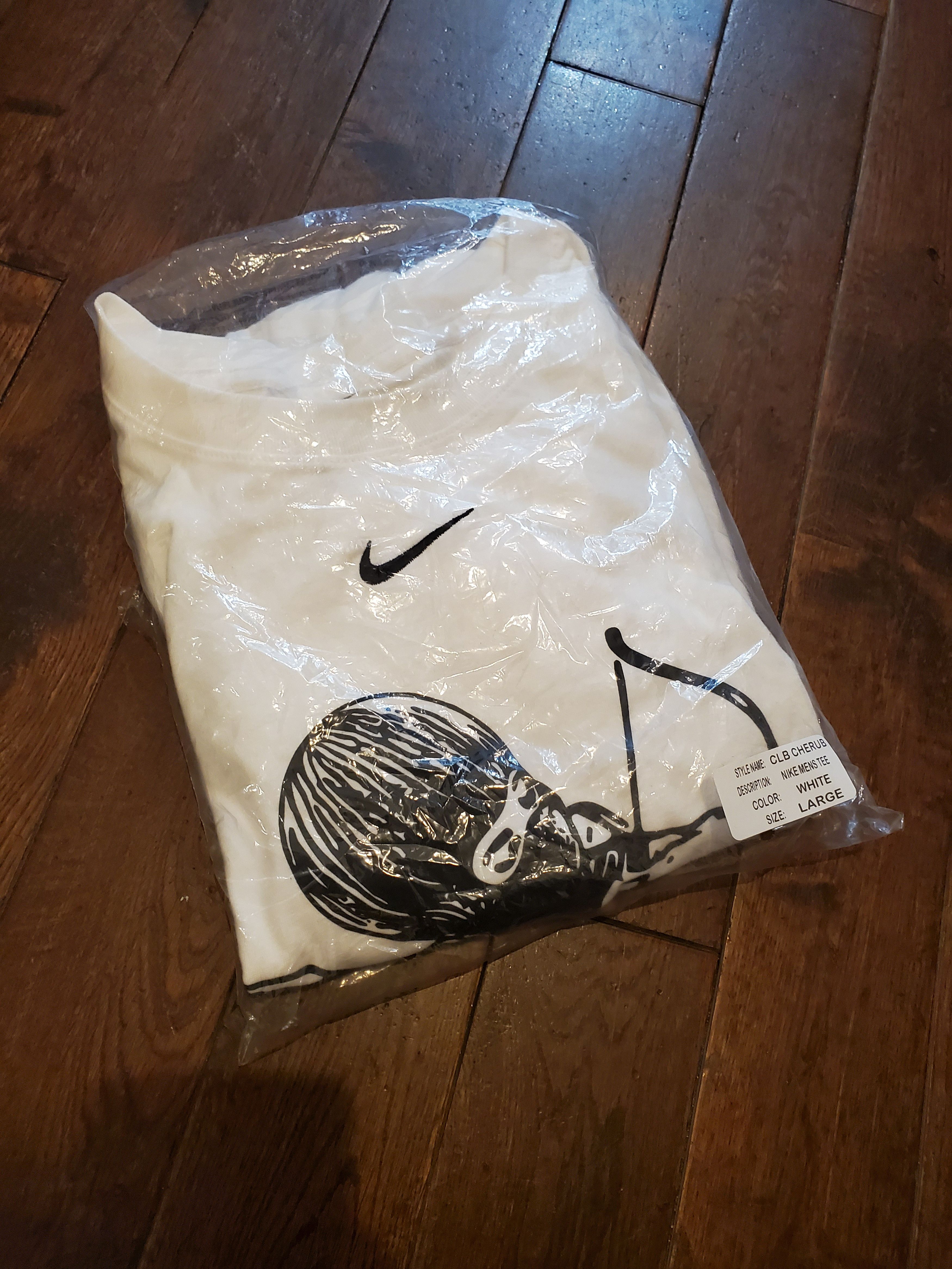 Nike × October's Very Own OVO x Nike CLB Cherub Centre Swoosh Shirt ...