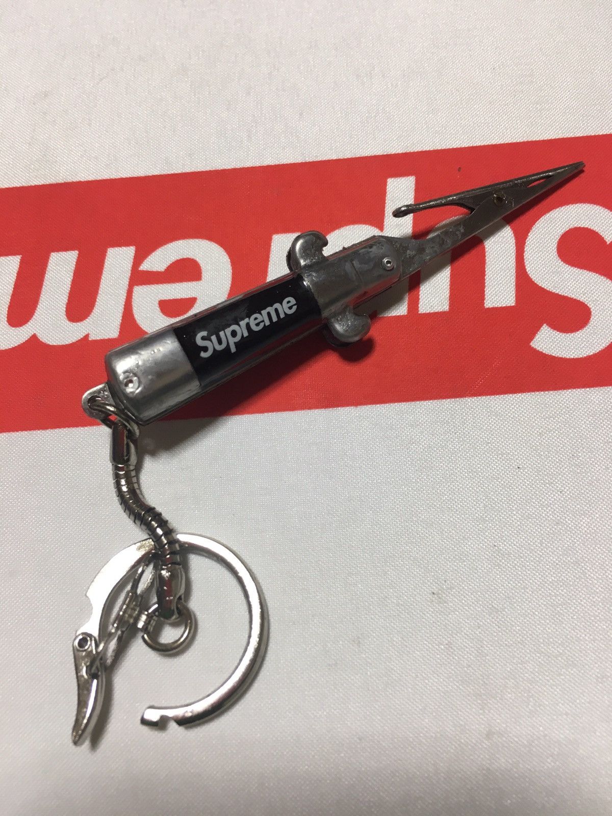 Supreme folding roach clip keychain black | Grailed