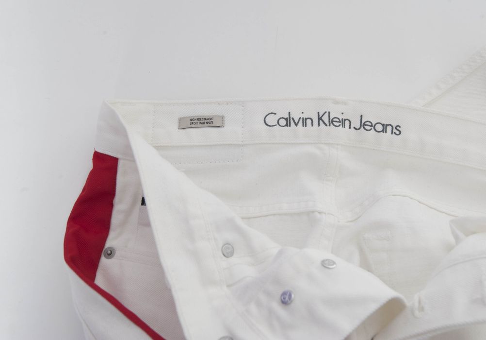 Calvin Klein White jeans with red stripe | Grailed