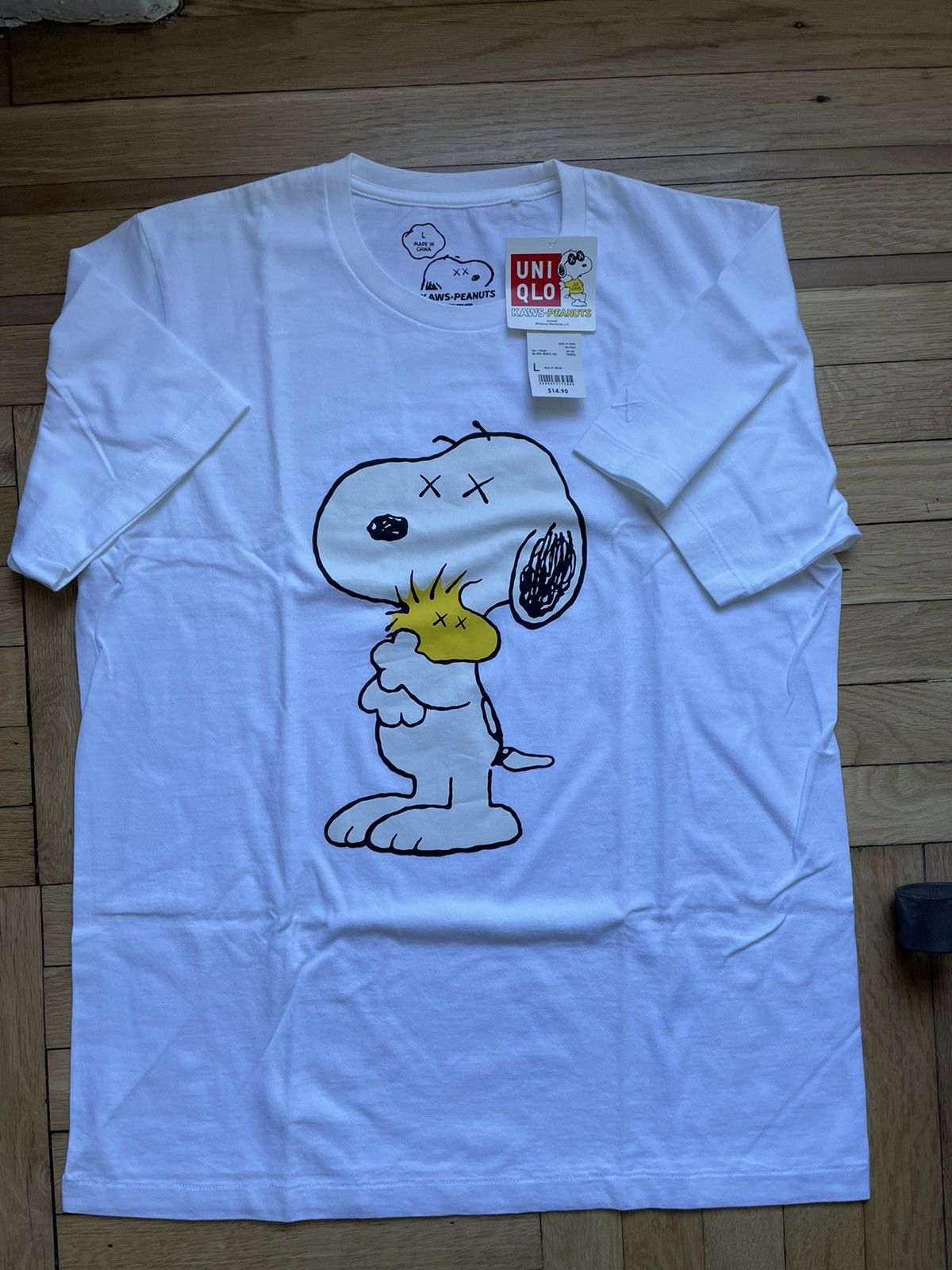 Kaws × Uniqlo Kaws Snoopy Woodstock tee | Grailed