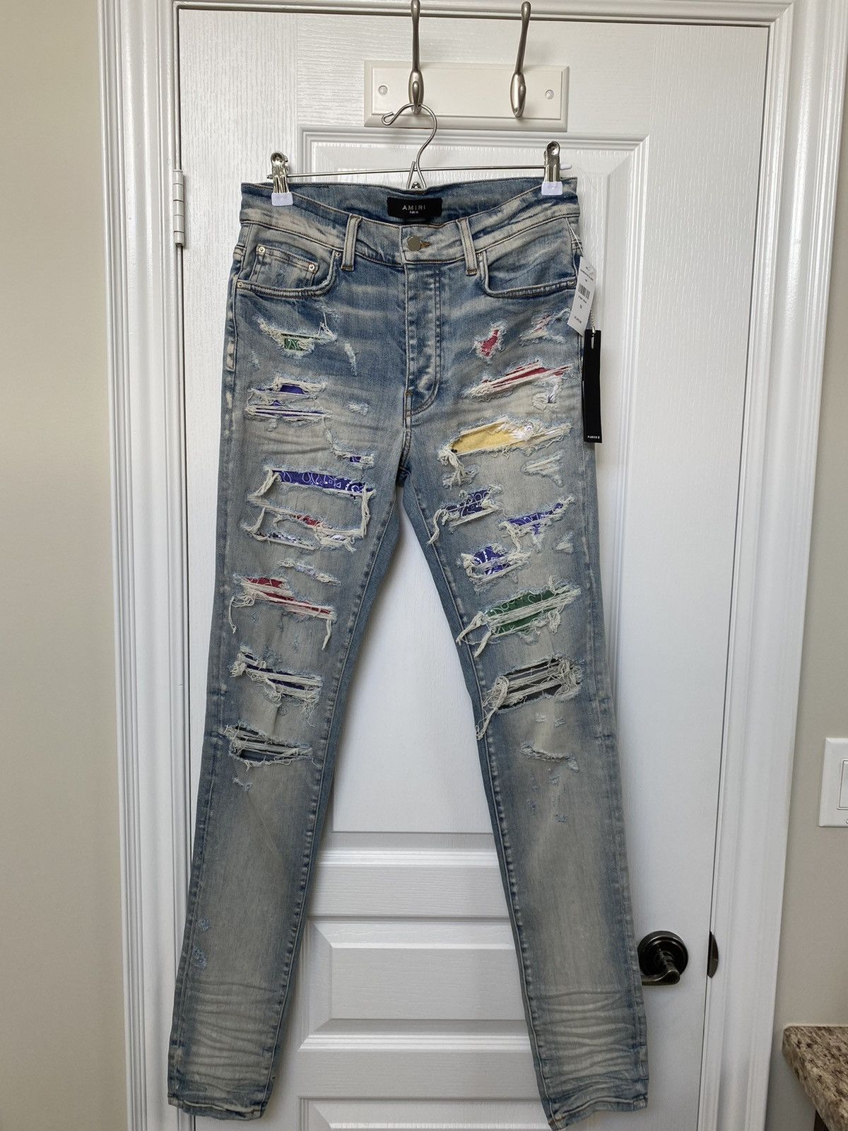 Amiri Amiri rainbow patch distressed denim | Grailed