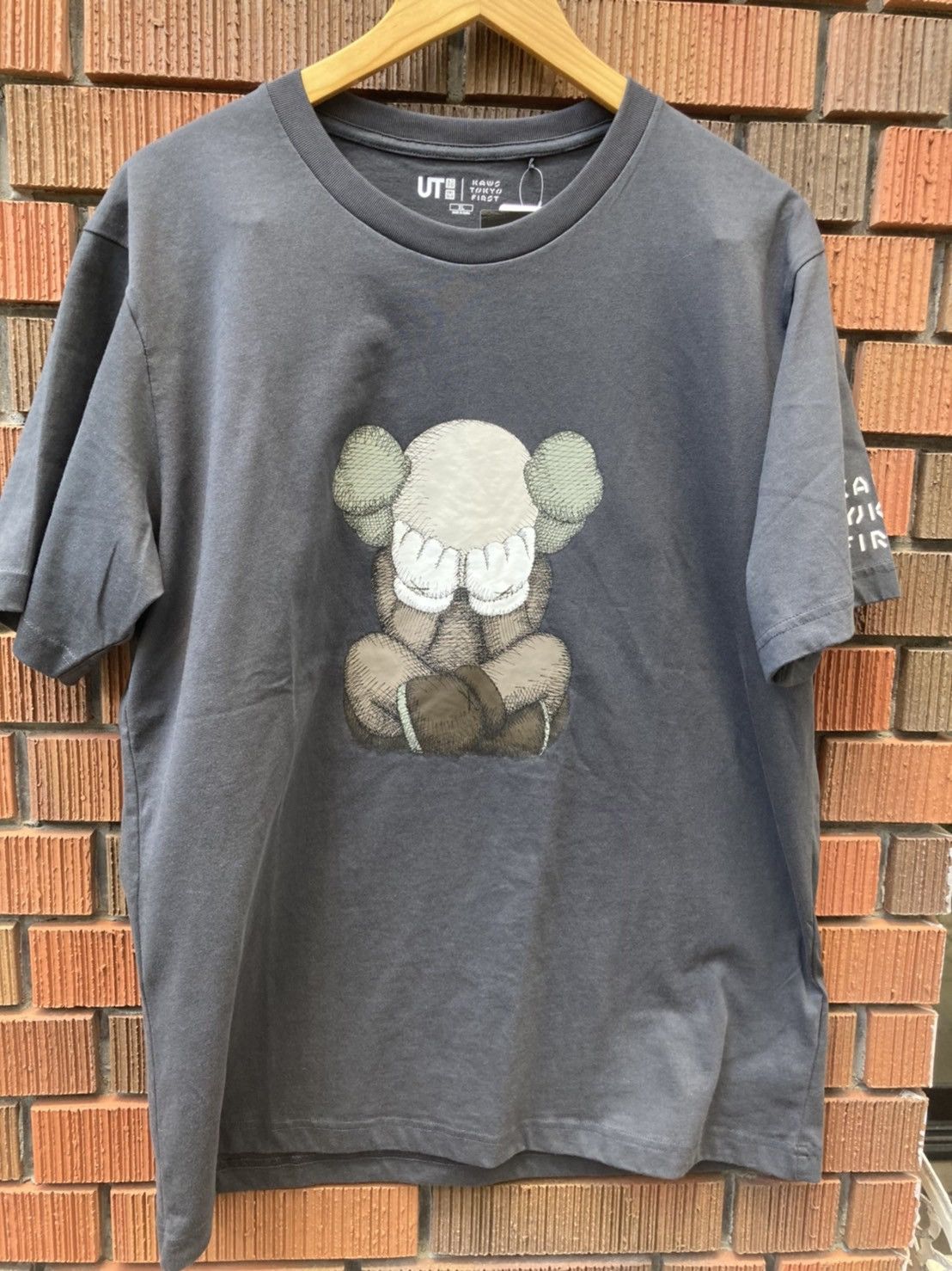 Kaws × Uniqlo Uniqlo × Kaws Graphic T-shirts Dark Grey | Grailed