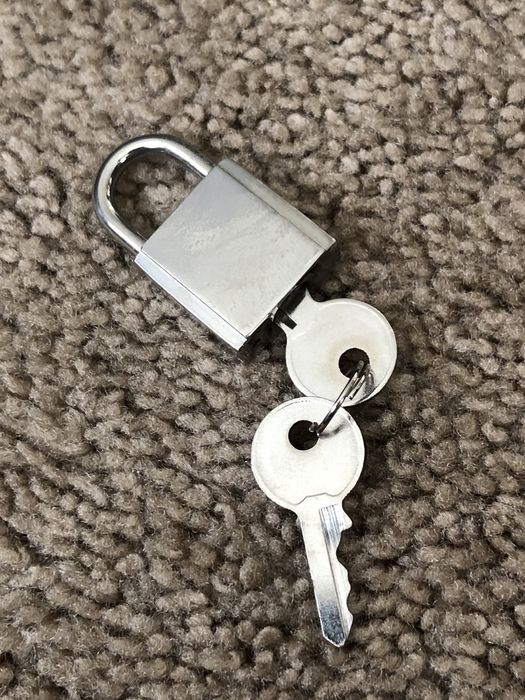 Prada Prada silver tone lock | Grailed