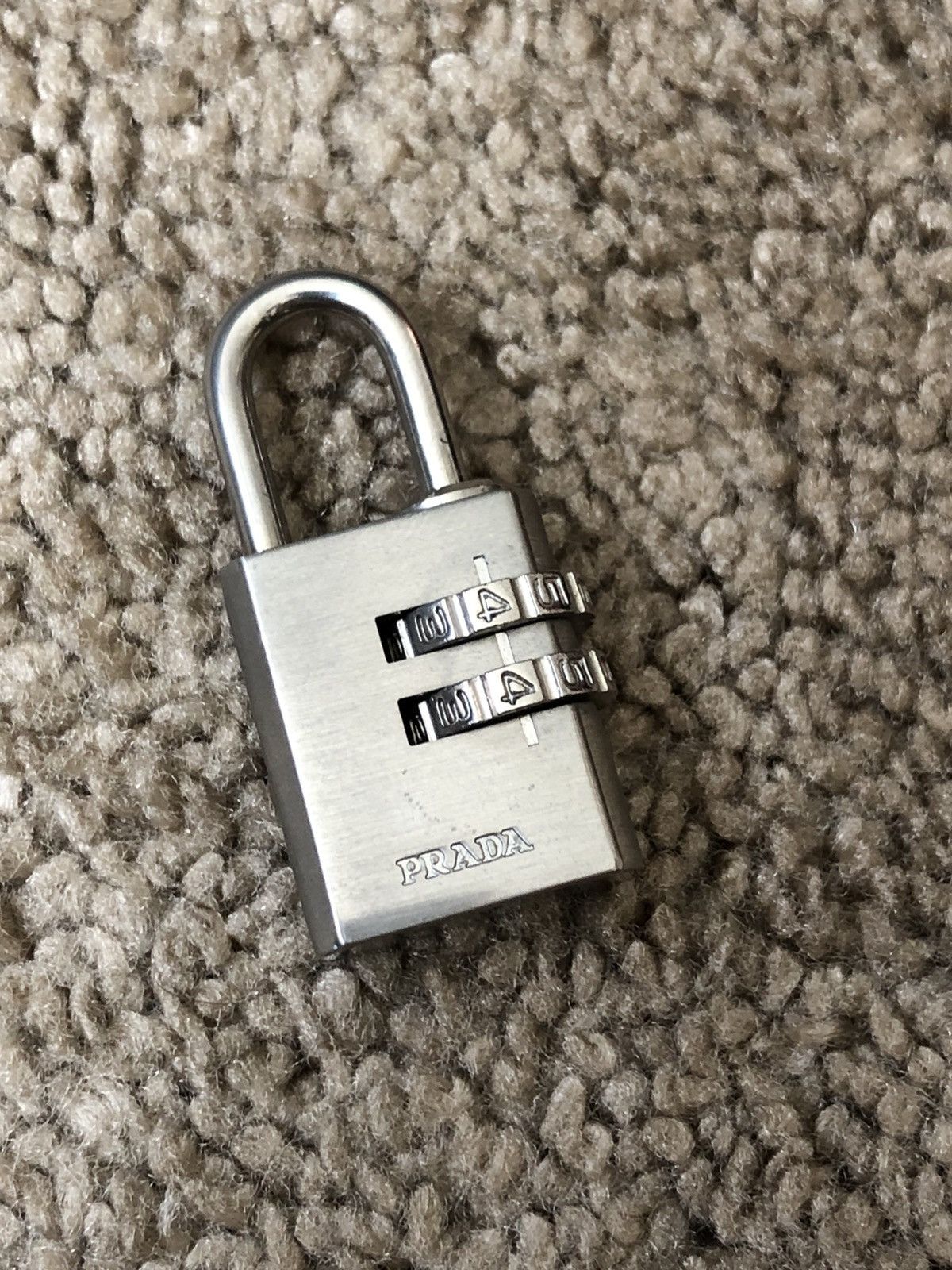 Prada Prada silver tone lock | Grailed