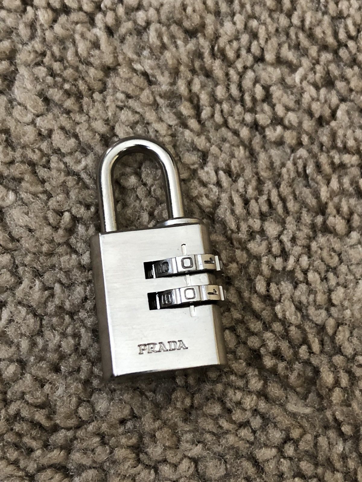 Prada Prada silver tone lock | Grailed