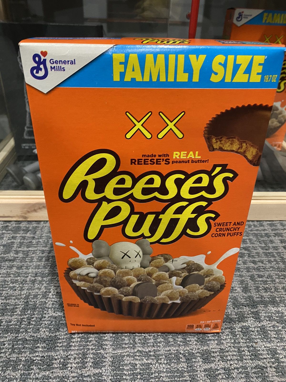Kaws KAWS REESES PUFFS special edition family size box | Grailed