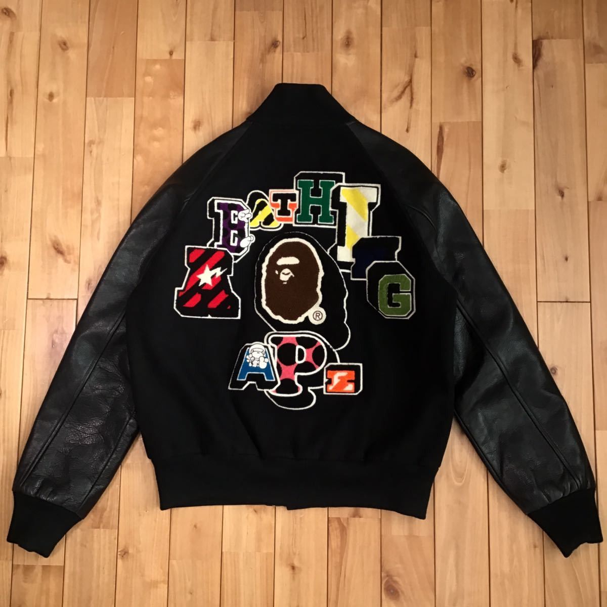 Bape BAPE Sleeve leather BAPE LOGO varsity jacket Black | Grailed