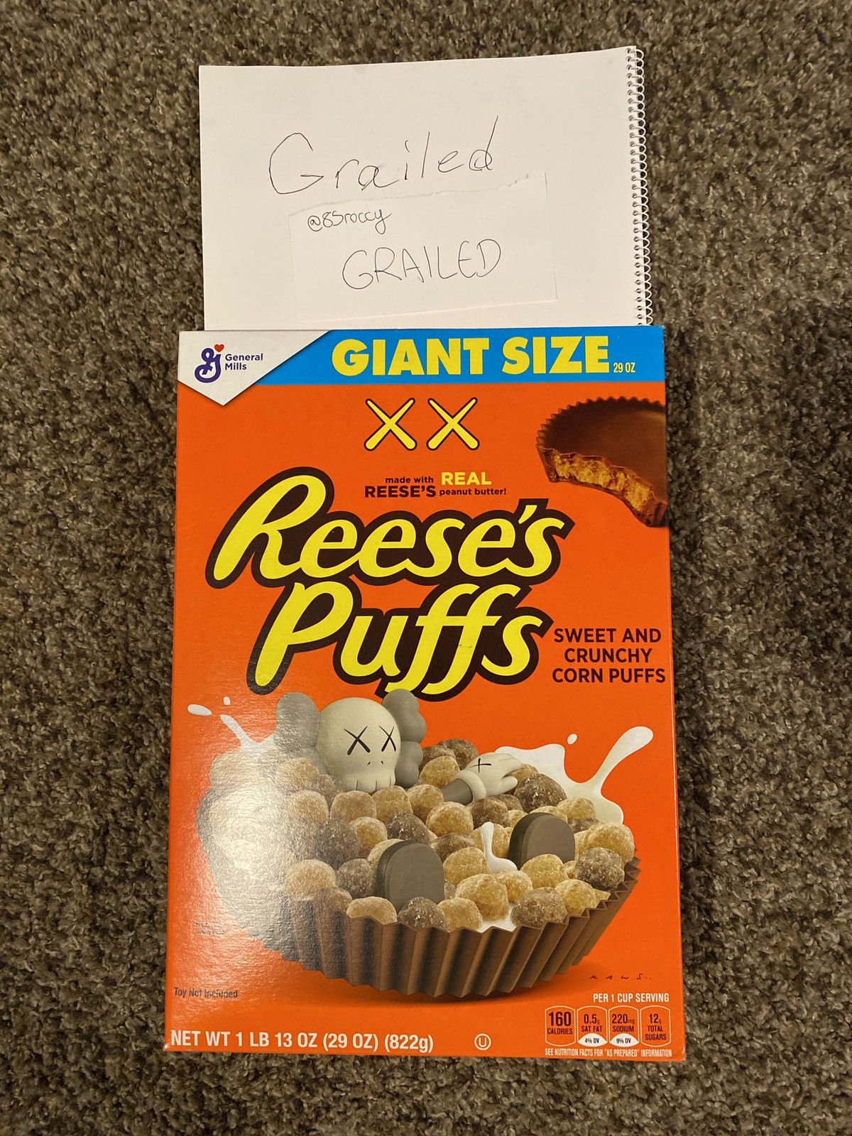 Kaws GIANT SIZE Kaws Reece’s Puffs Cereal | Grailed