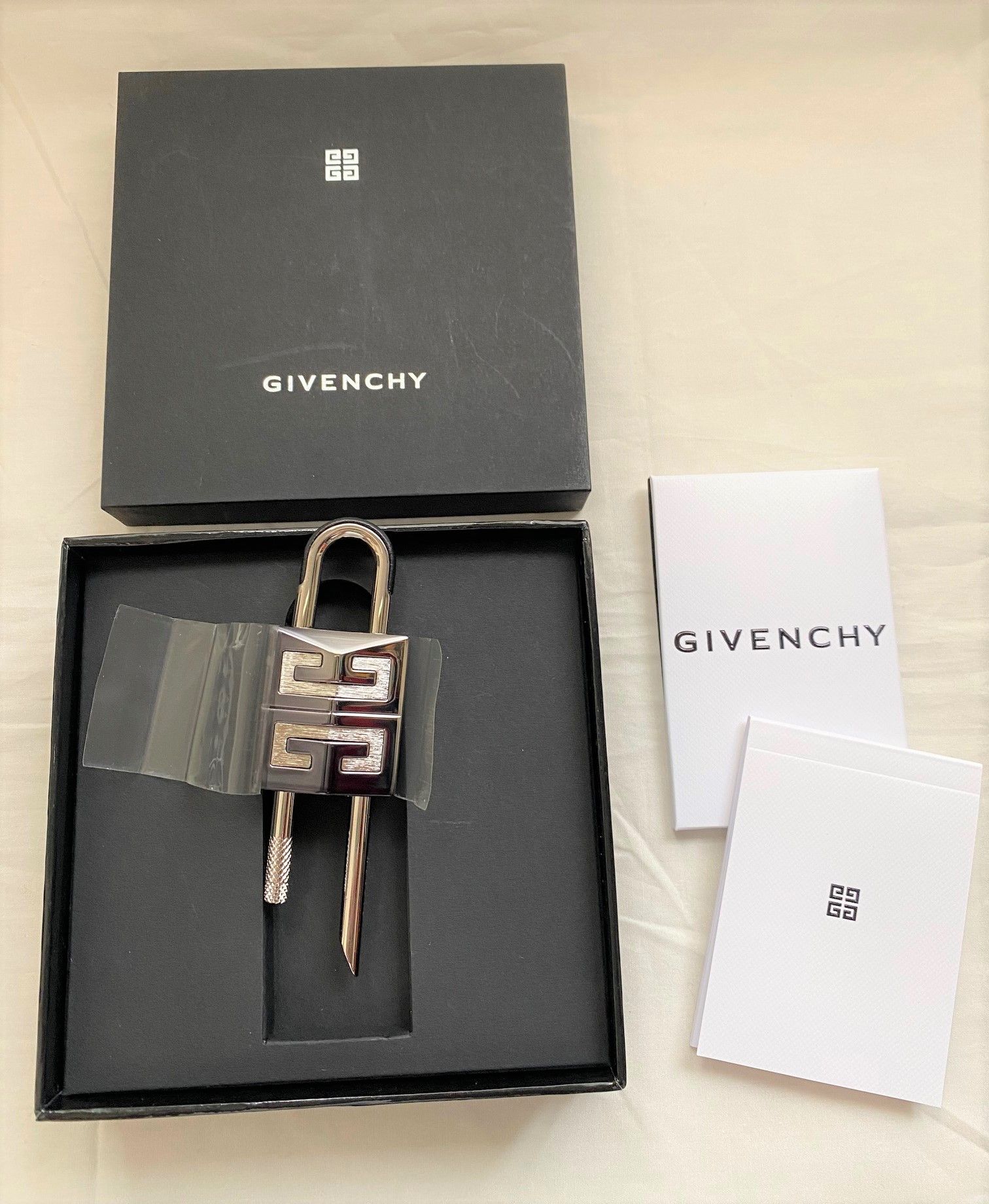 Givenchy Givenchy by Matthew M. Williams logo 4G padlock charm | Grailed
