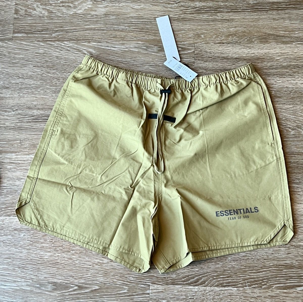 Fear of God Essentials volley Shorts Amber | Grailed
