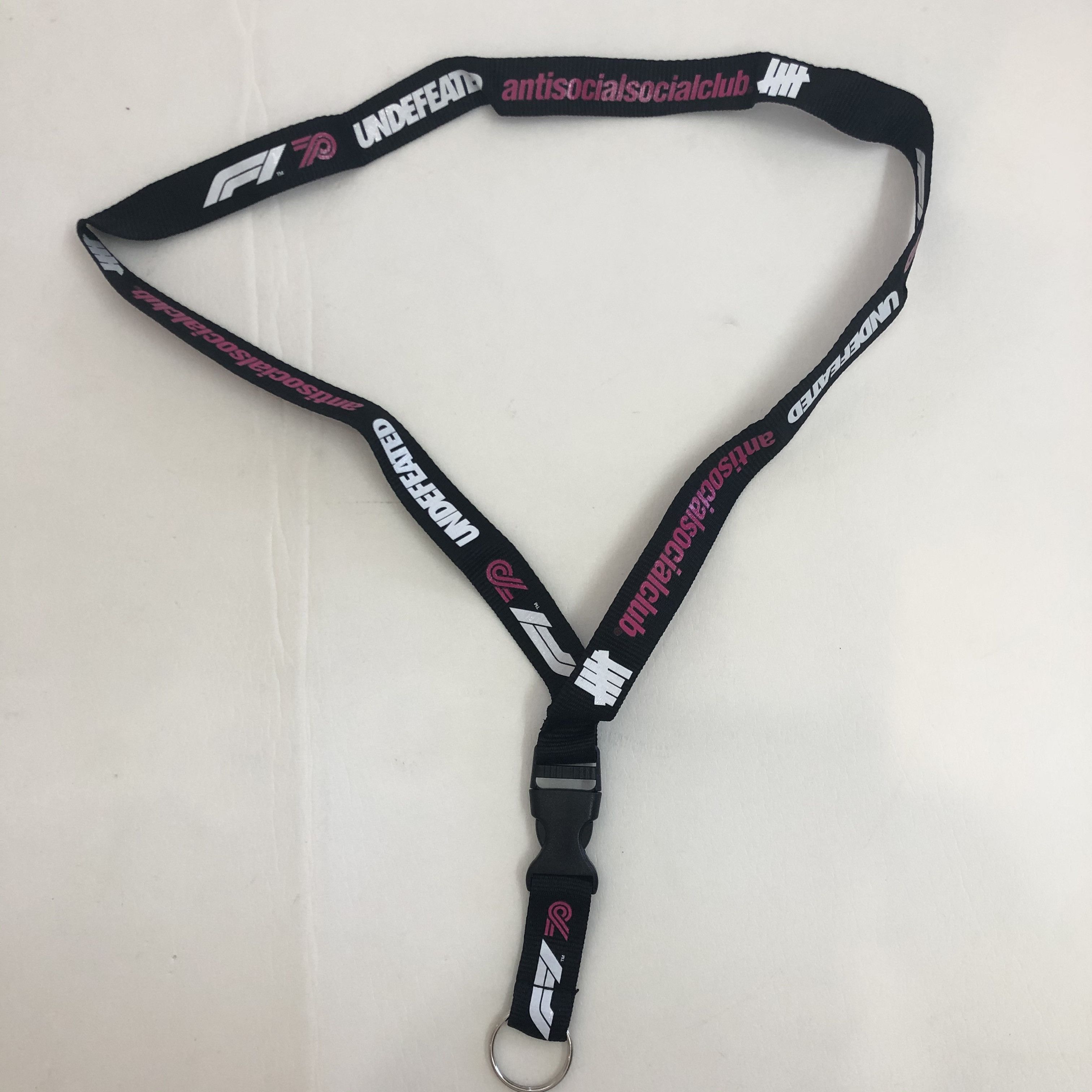 Undefeated DS Pink ASSC X UNDFTD X F1® White Logo Lanyard Keychain ...