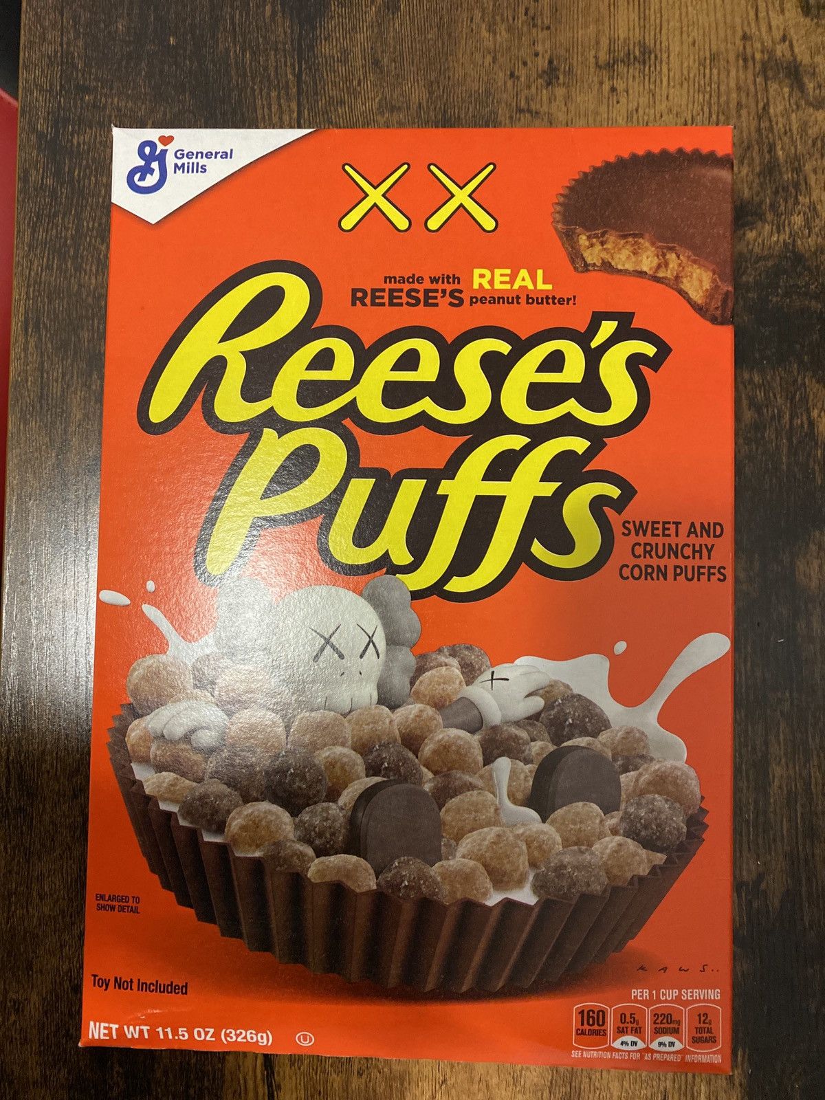 Kaws KAWS X REESE’S PUFF CEREAL COLLECTABLE LIMITED EDITION | Grailed