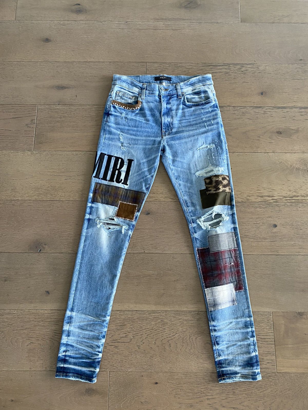 Amiri Amiri Patches Distressed Jeans | Grailed