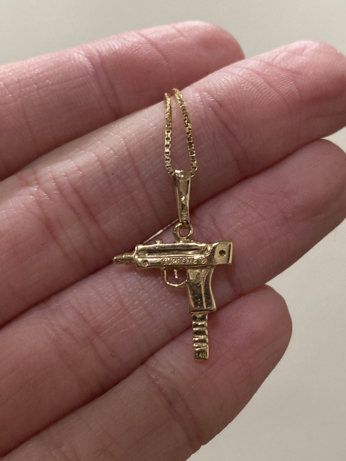 Supreme Supreme 14k solid gold Uzi | Grailed
