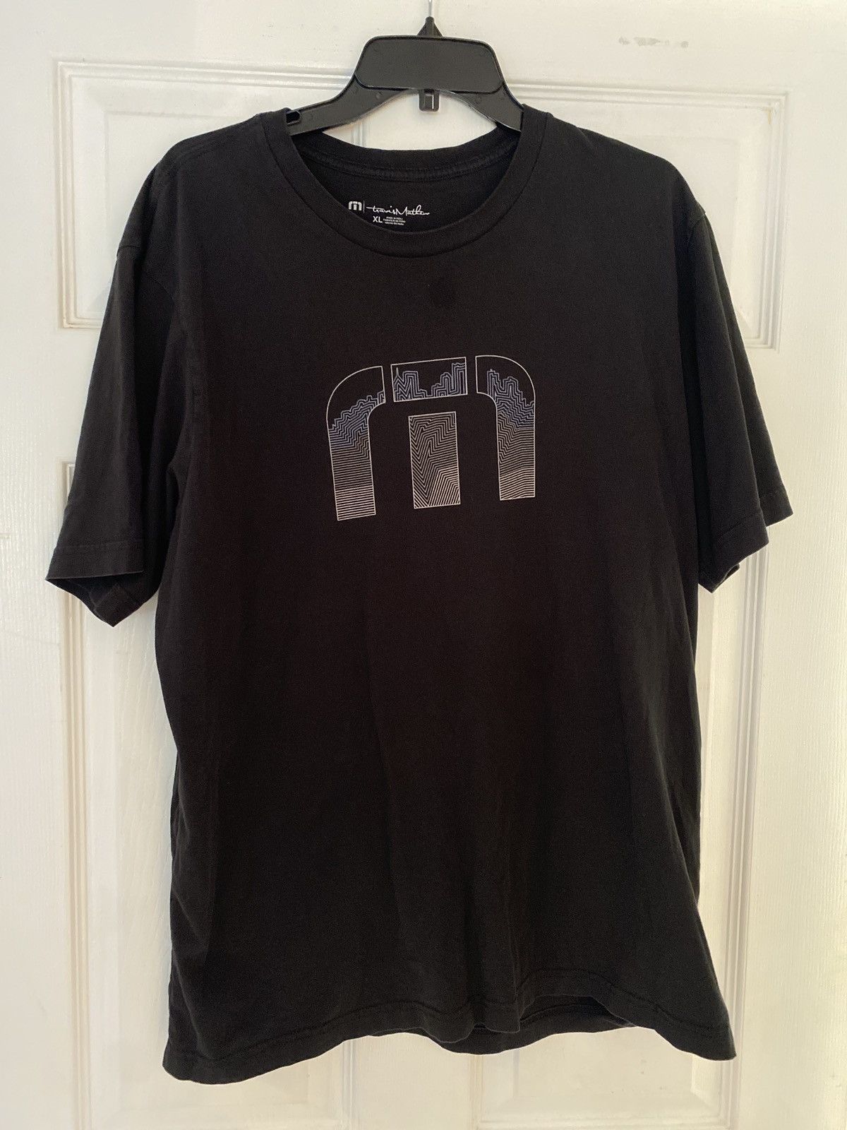 TravisMathew Travis Mathis logo black T-shirt | Grailed