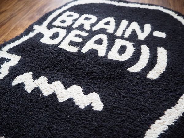 Brain Dead BRAIN DEAD LOGO HEAD RUG - BLACK | Grailed