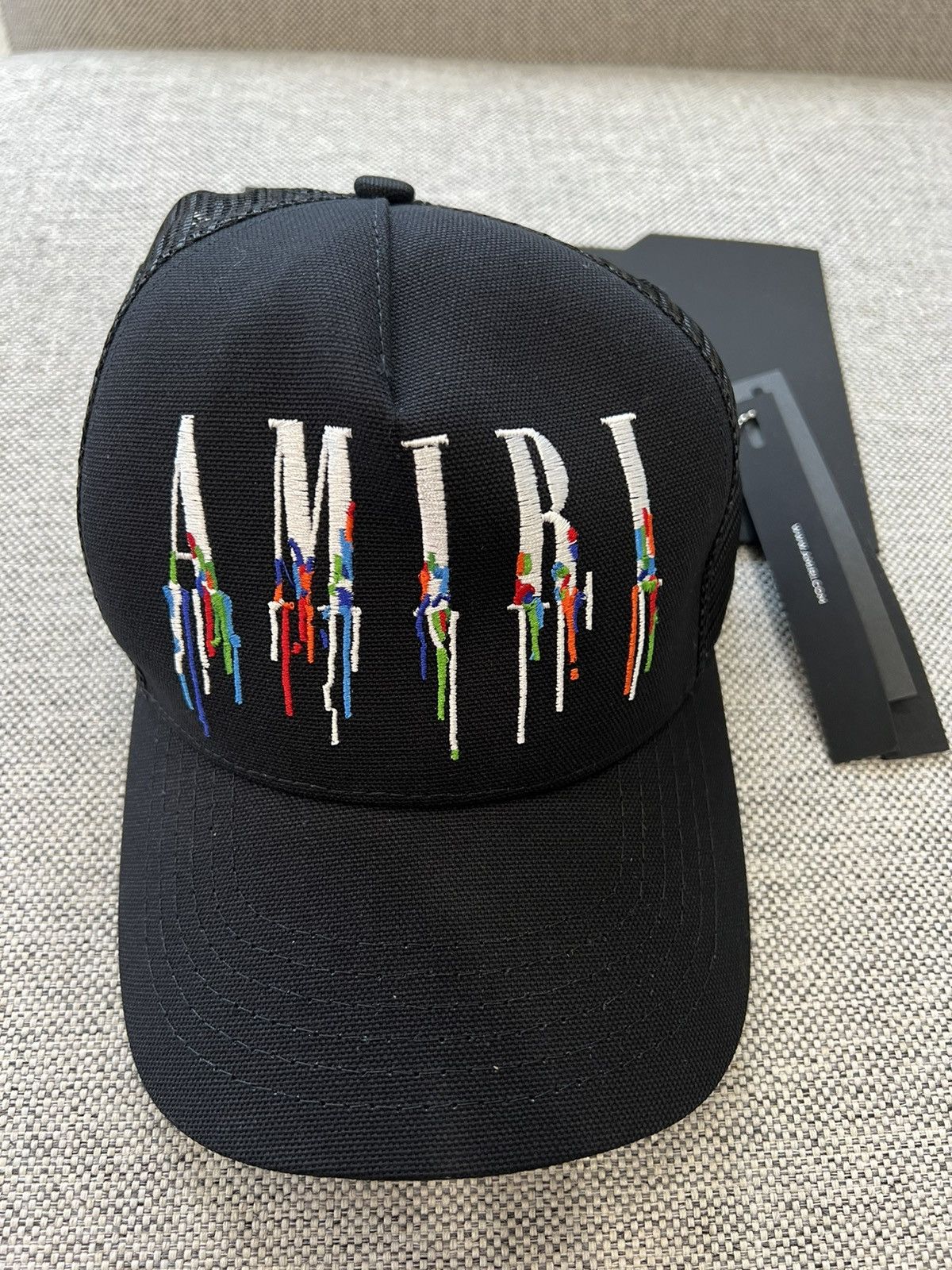 Amiri Amiri Paint Drip Logo Trucker Hat Black | Grailed