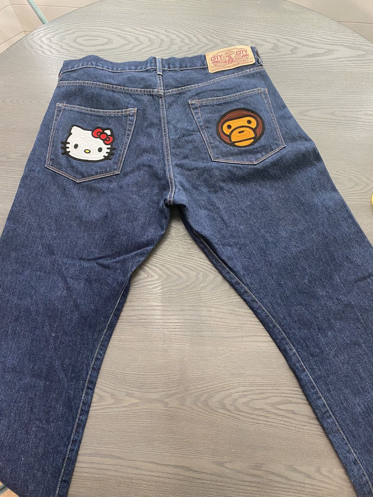 Bape Bape / baby milo hello kitty embroidered pocket Jeans | Grailed