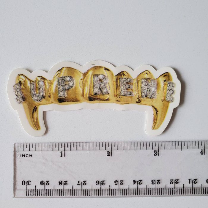 Supreme SUPREME Gold Fronts Grills Teeth Sticker Brick Logo, 3.5in ...