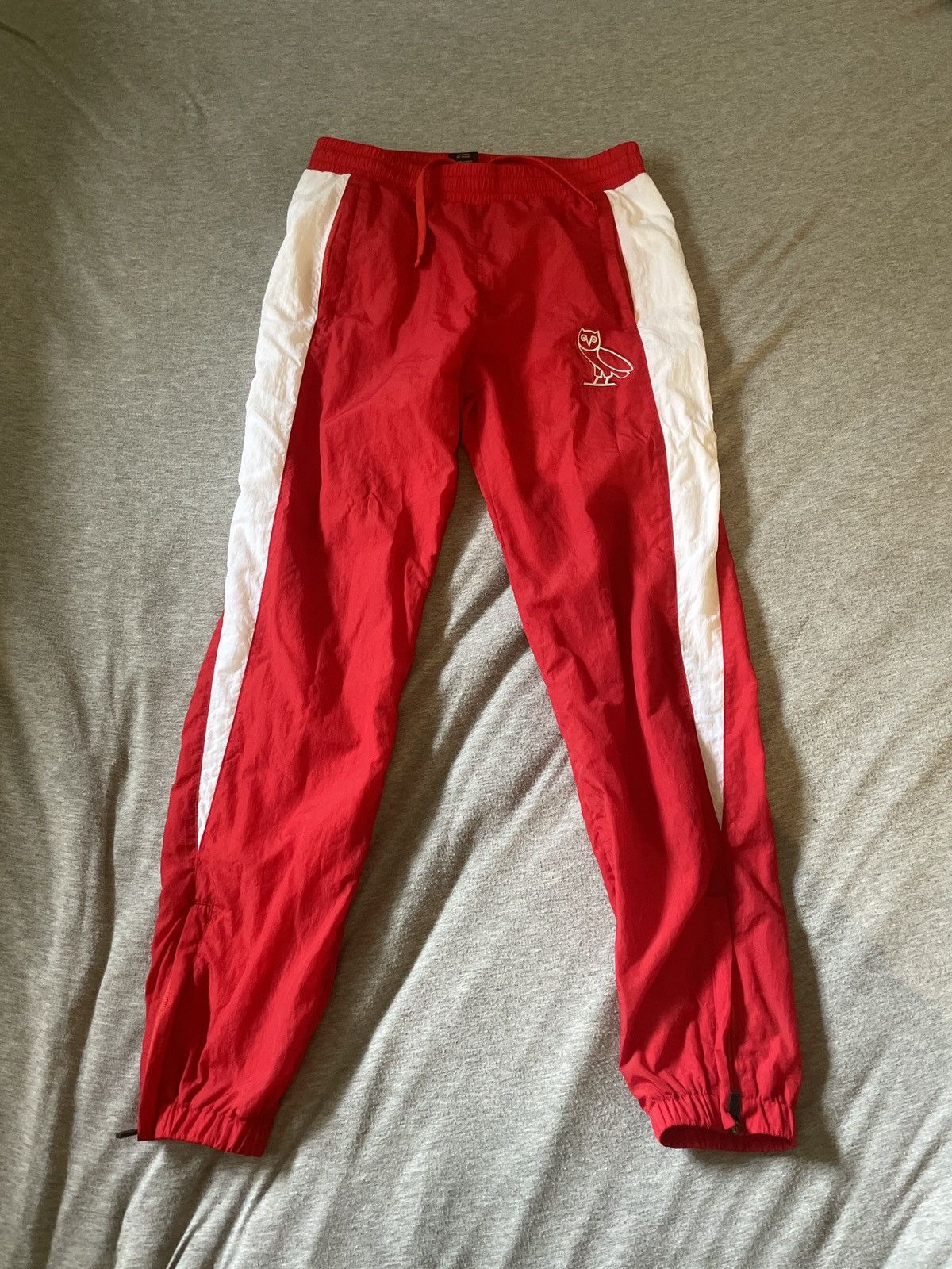 Octobers Very Own Red OVO nylon track pants (Small) | Grailed