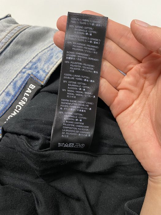 Balenciaga Slashed jeans in blue with red sporty b trackpants layering ...