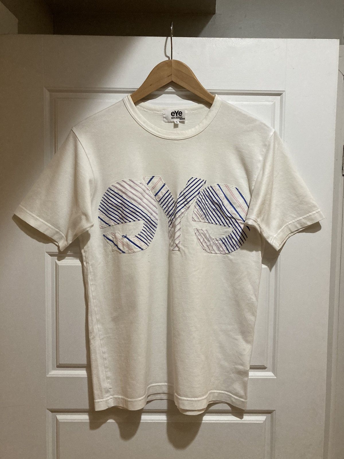 Junya Watanabe Junya Watanabe eYe patchwork logo tee | Grailed