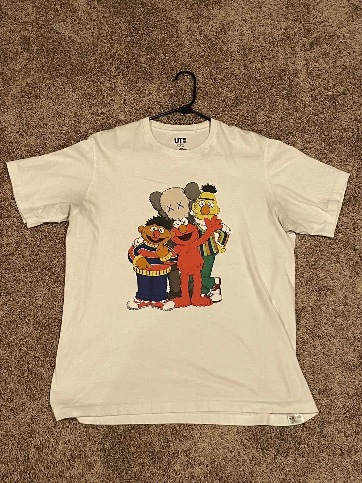 Kaws × Uniqlo Kaws Sesame Street uniqlo elmo shirt | Grailed