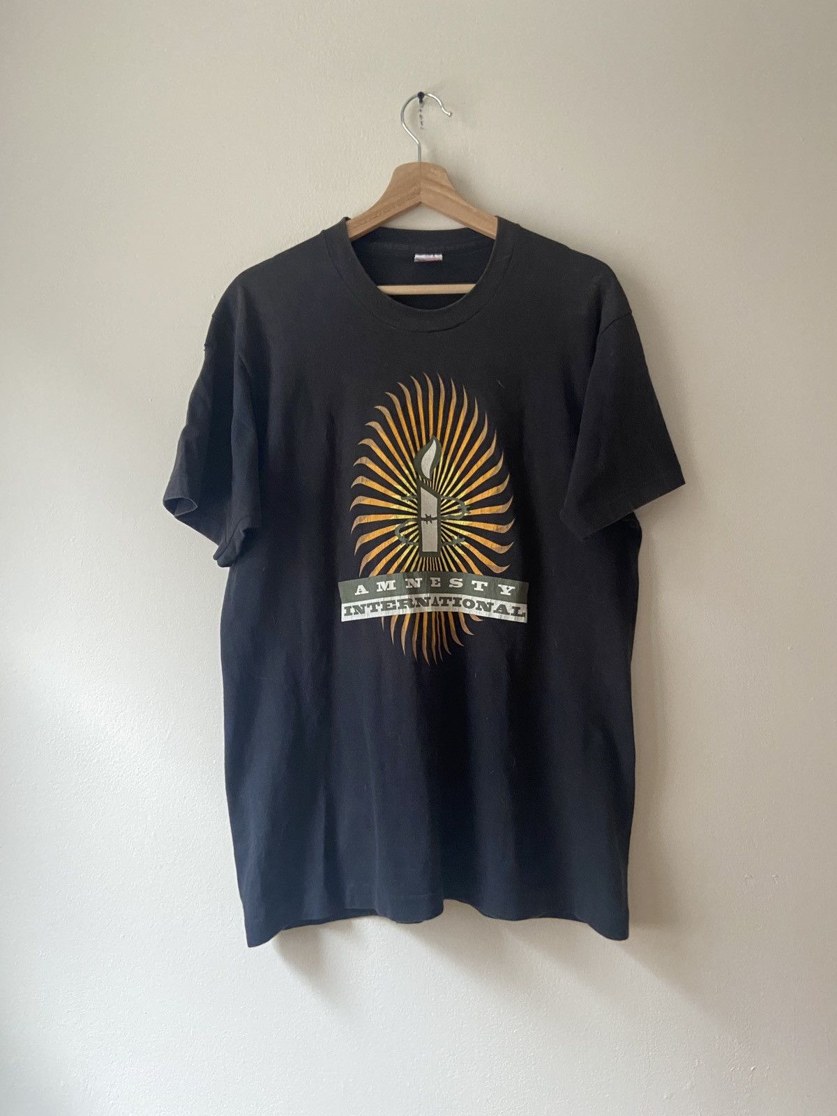 Vintage Vintage 90’s Amnesty International Art black tee shirt | Grailed