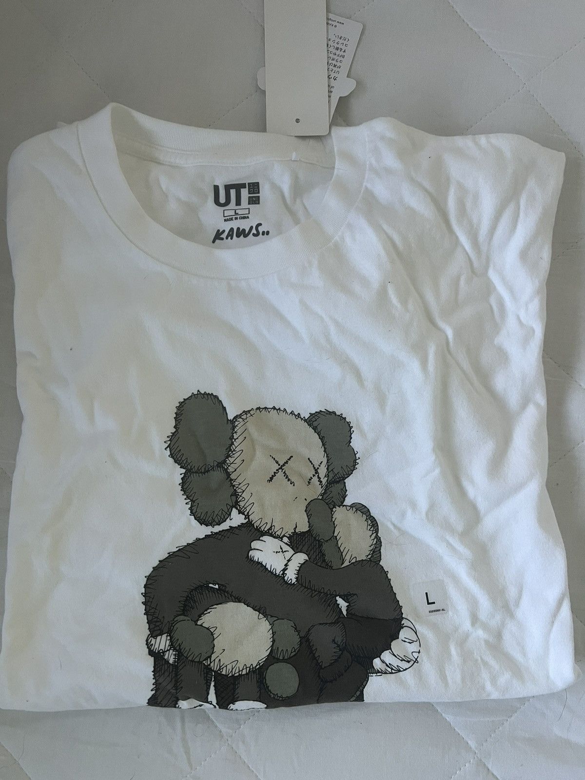 Uniqlo Uniqlo x KAWS | Grailed