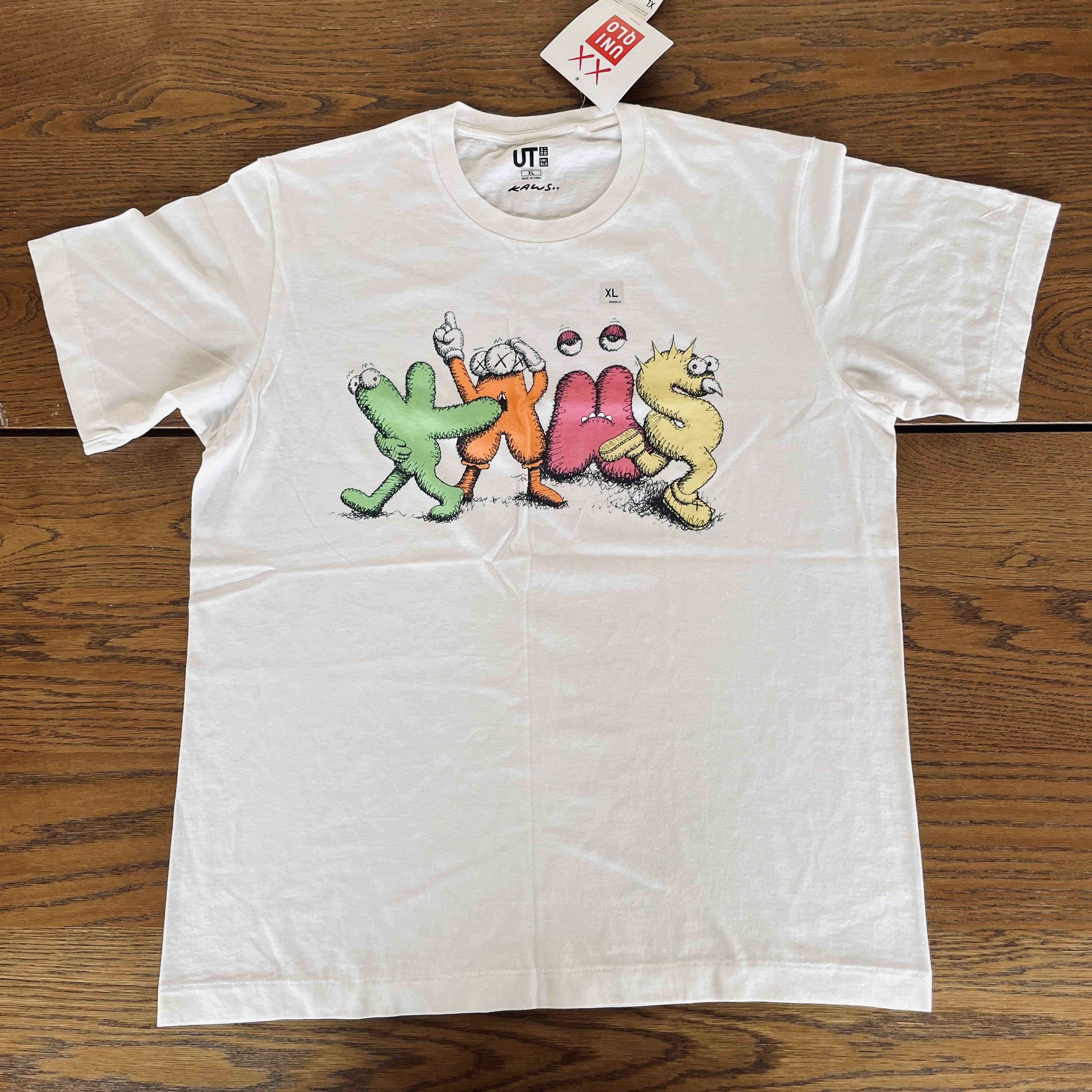 Kaws × Uniqlo Uniqlo Kaws Letters Tee | Grailed