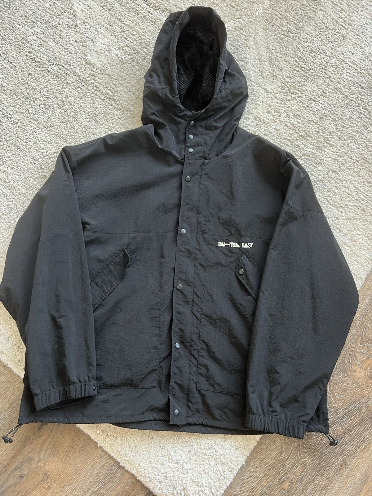 18 East Waterfront Hooded Shell - Black Taslan | Grailed