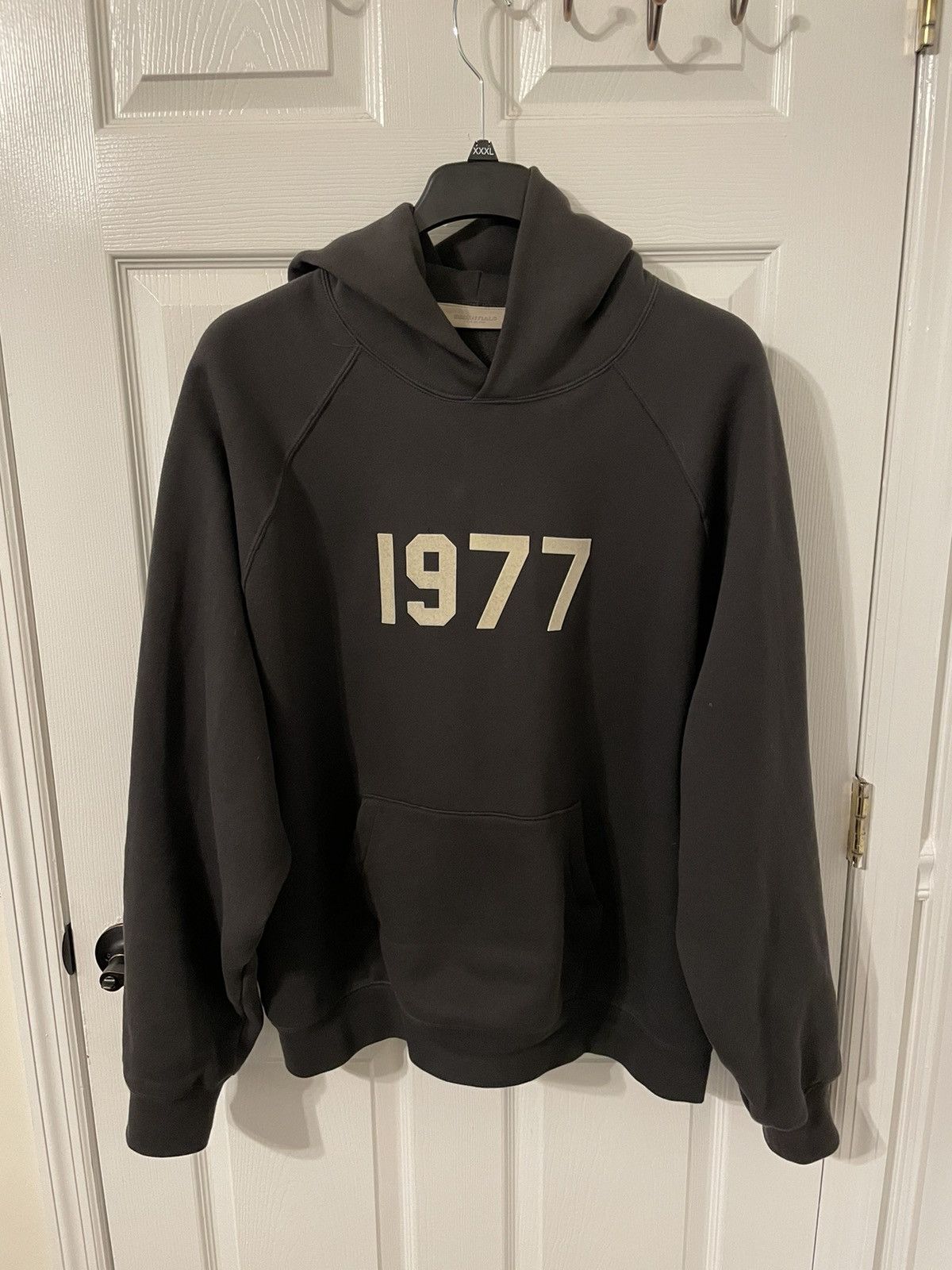 Fear of God Fear of God Essentials Black “1977” Hoodie | Grailed