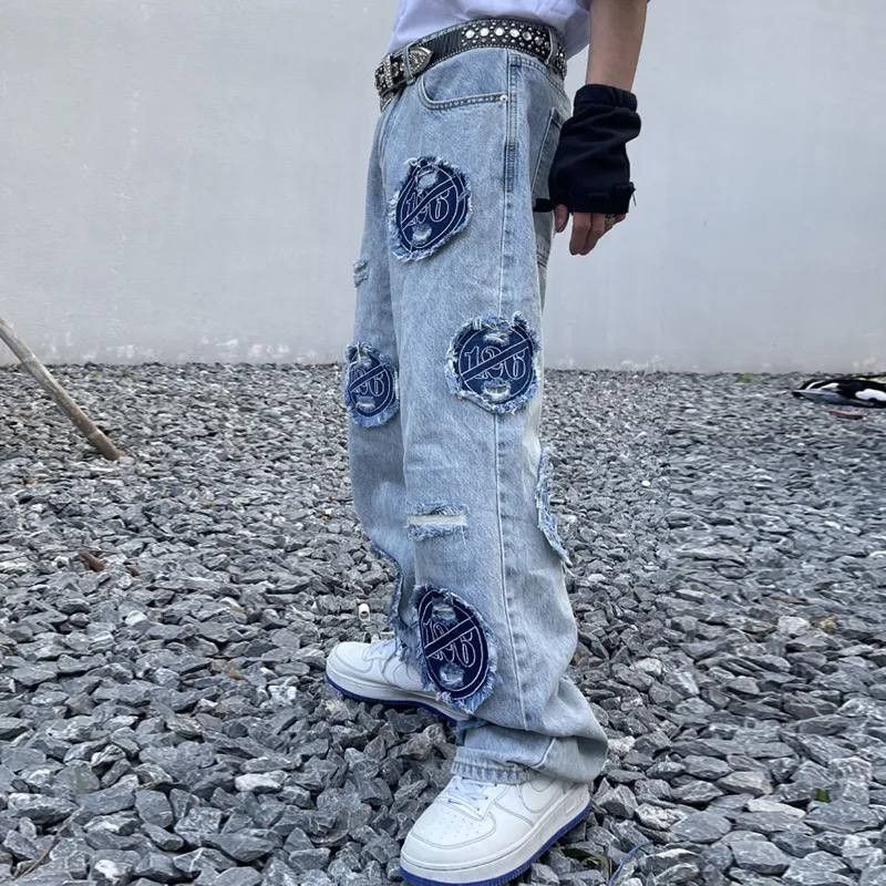 Vintage Ripped straight leg pants with cutouts and slogan | Grailed