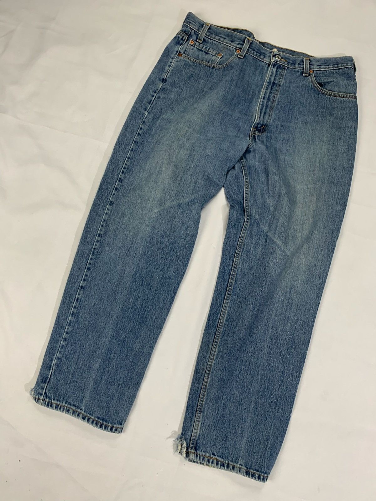 Levi's × Vintage Vintage Levi’s Ripped Hem 550 40 x 30 | Grailed
