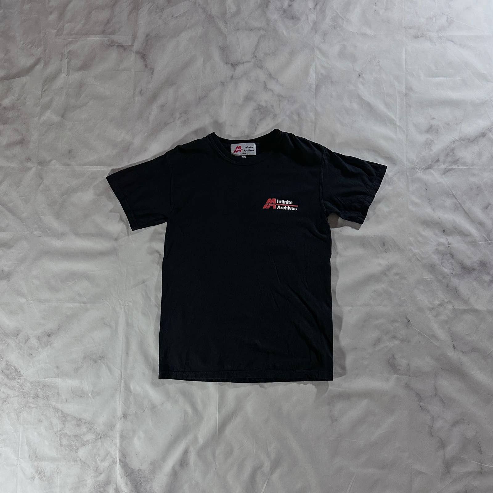 Infinite Archives New World Order Black Tee | Grailed