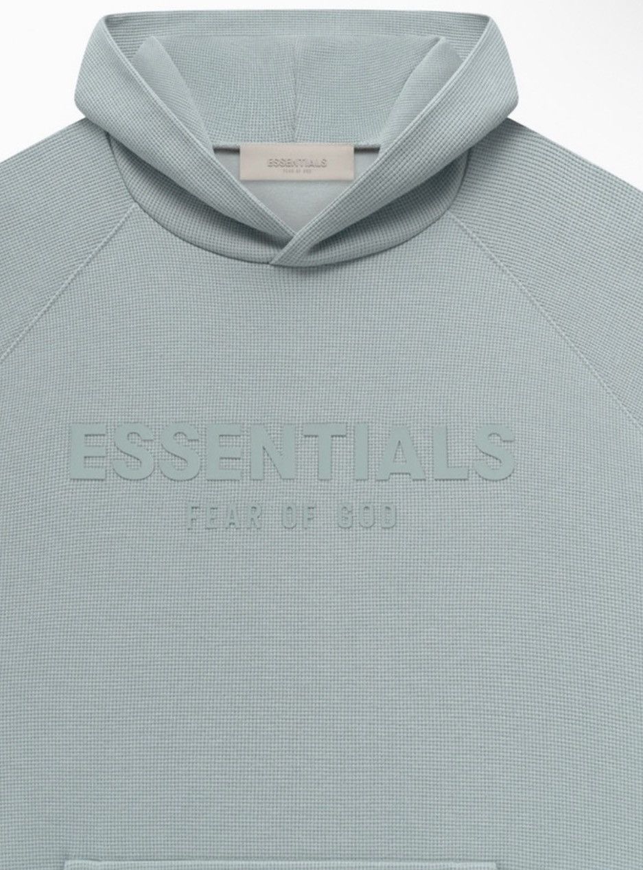 Essentials Essential Fear of God (FOG) Raglan Hoodie in Sycamore | Grailed