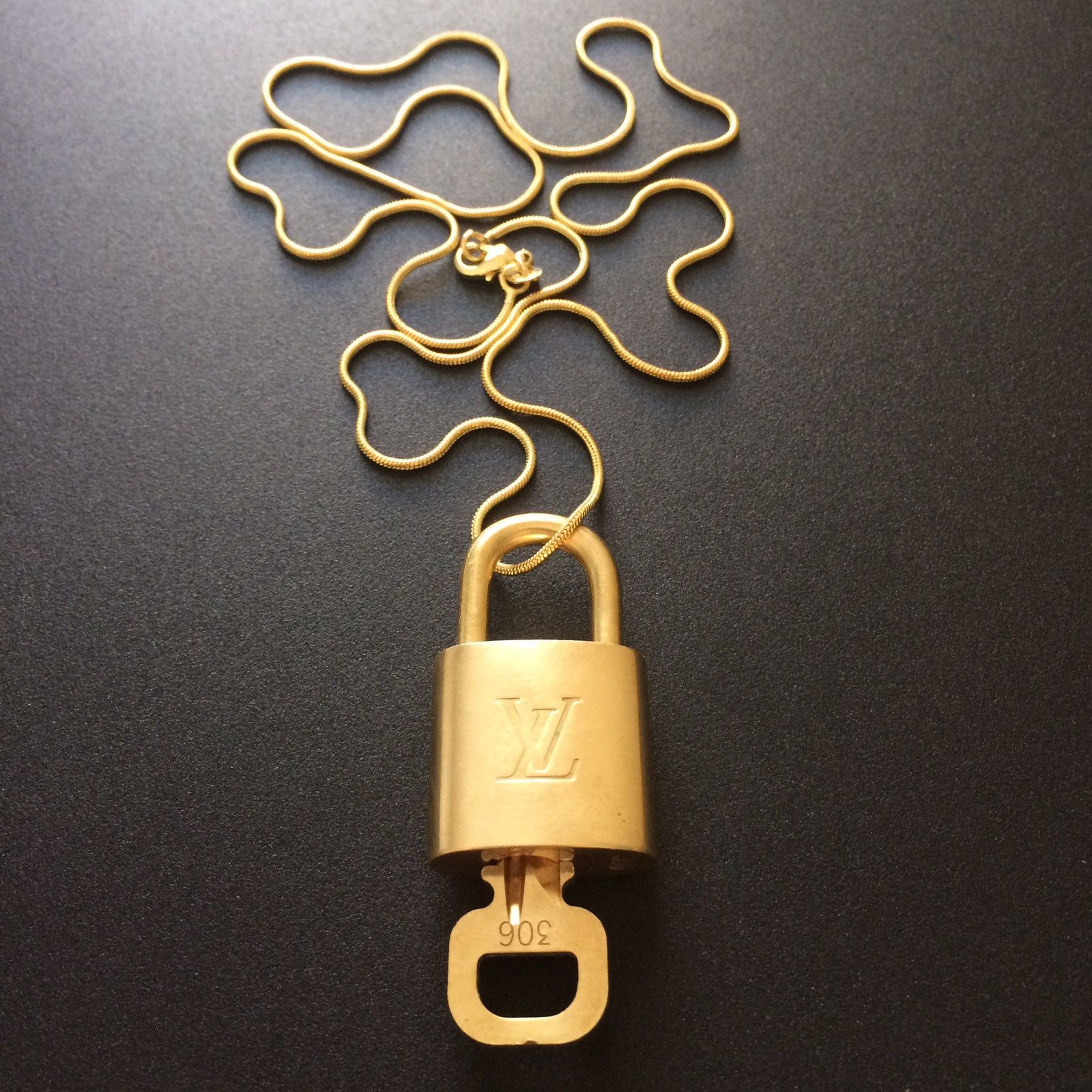 Louis Vuitton LV Lock And Gold Chain | Grailed