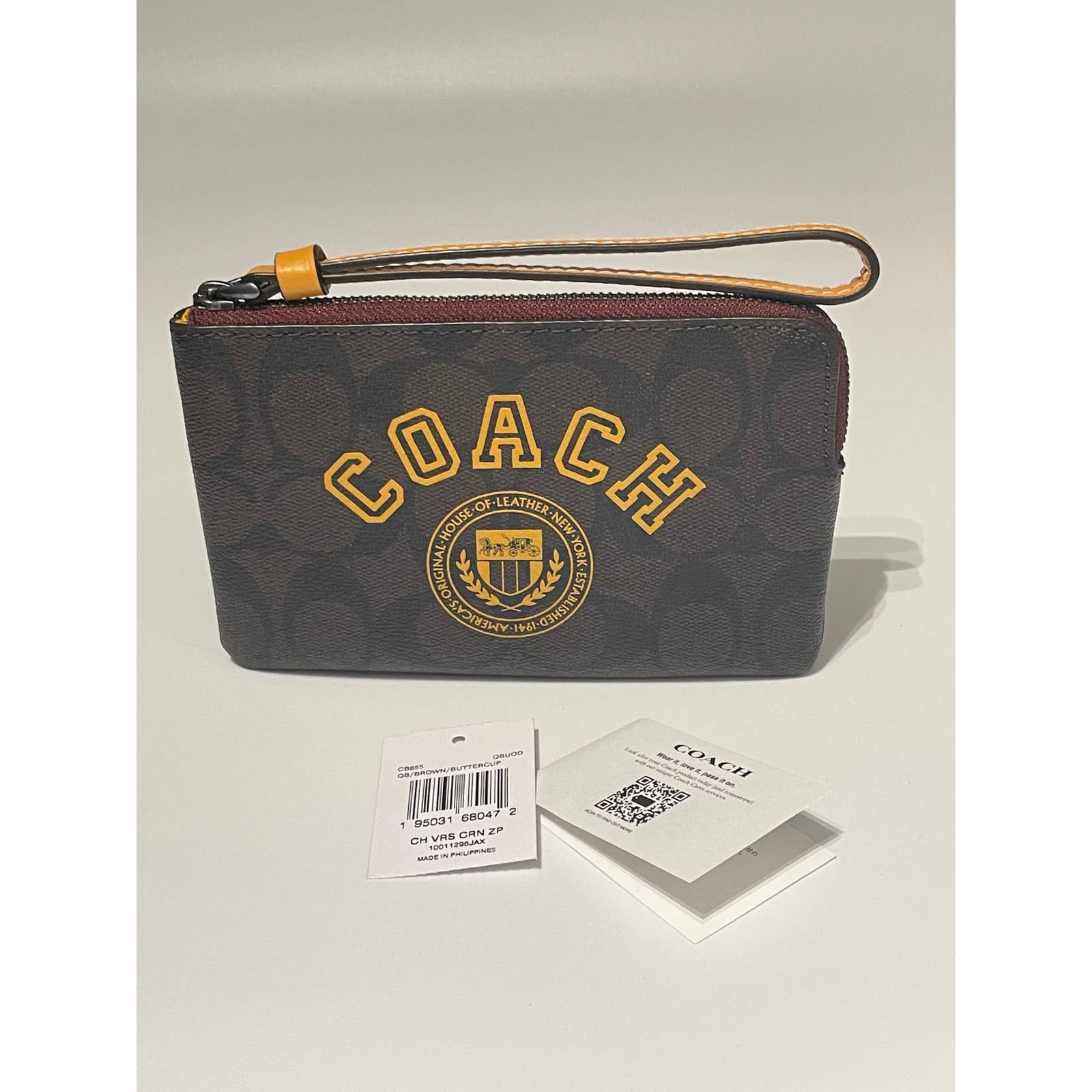 Coach Coach Corner Zip Wristlet In Signature Canvas With Varsity | Grailed