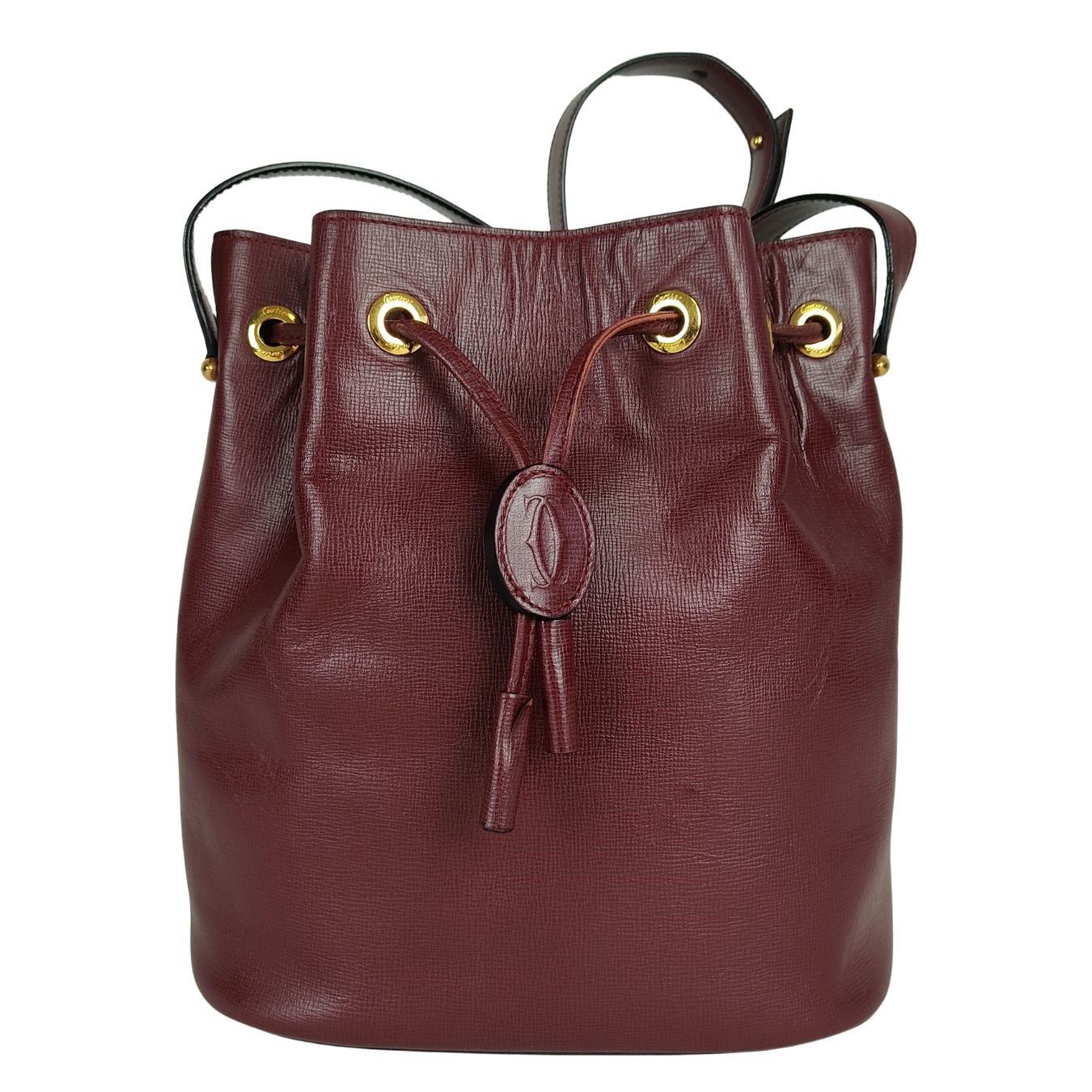 Cartier Cartier vintage bucket bag in burgundy leather | Grailed