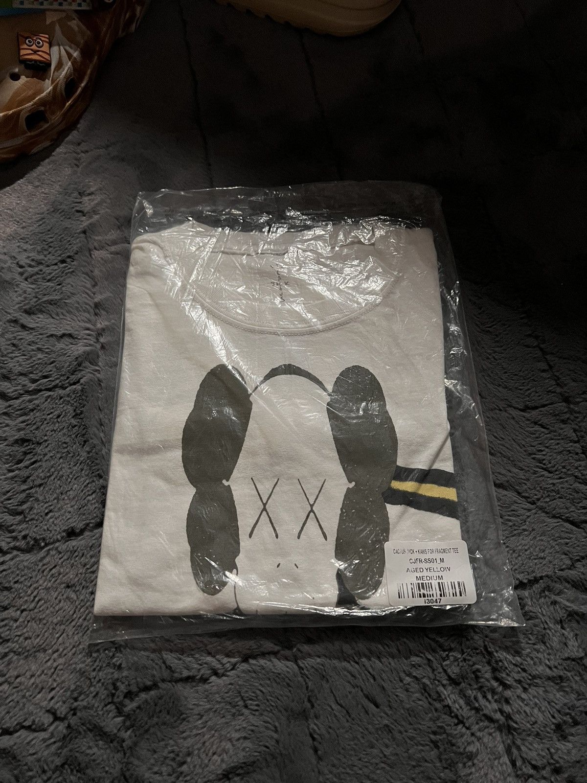 Kaws × Travis Scott Kaws X Travis Scott X Fragment aged yellow tee ...