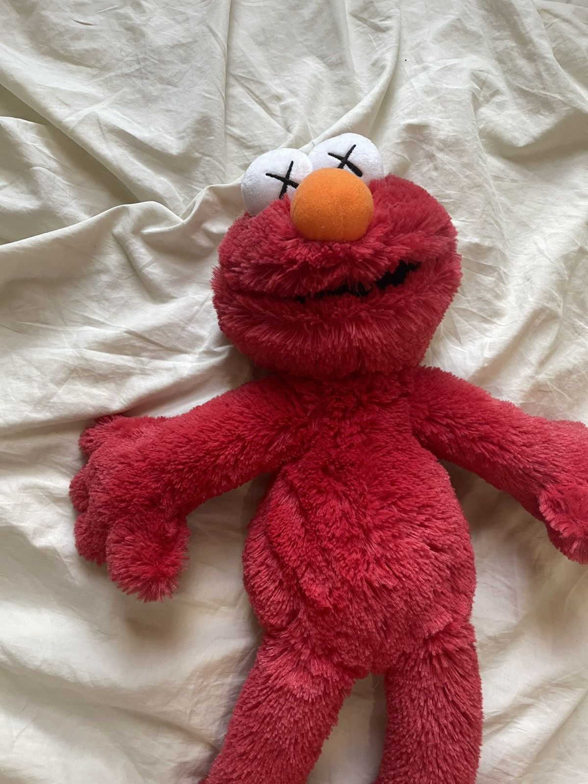 Kaws × Uniqlo Sesame Street x KAWS x Elmo | Grailed