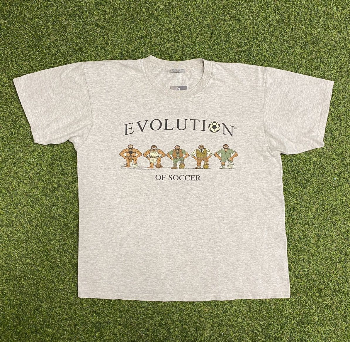 Vintage Vintage 90s Evolution Of Soccer Graphic Caveman T-Shirt | Grailed