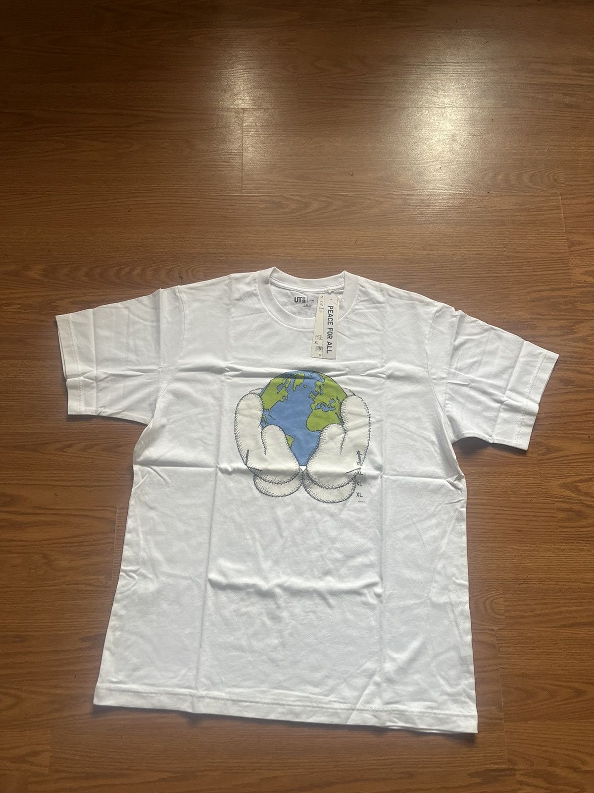 Uniqlo Kaws peace for all tee | Grailed