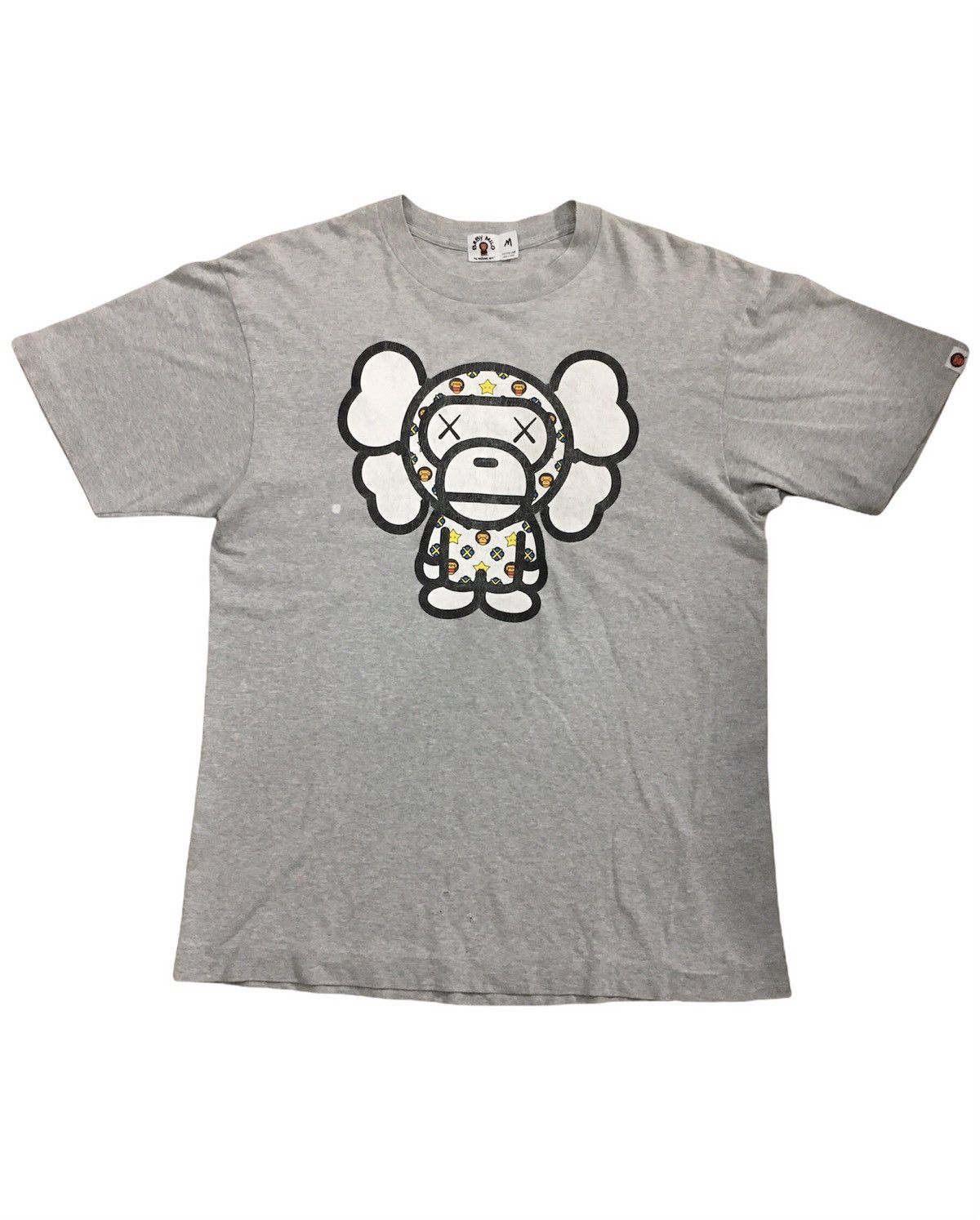 Bape Bathing ape baby milo x kaws tshirt | Grailed